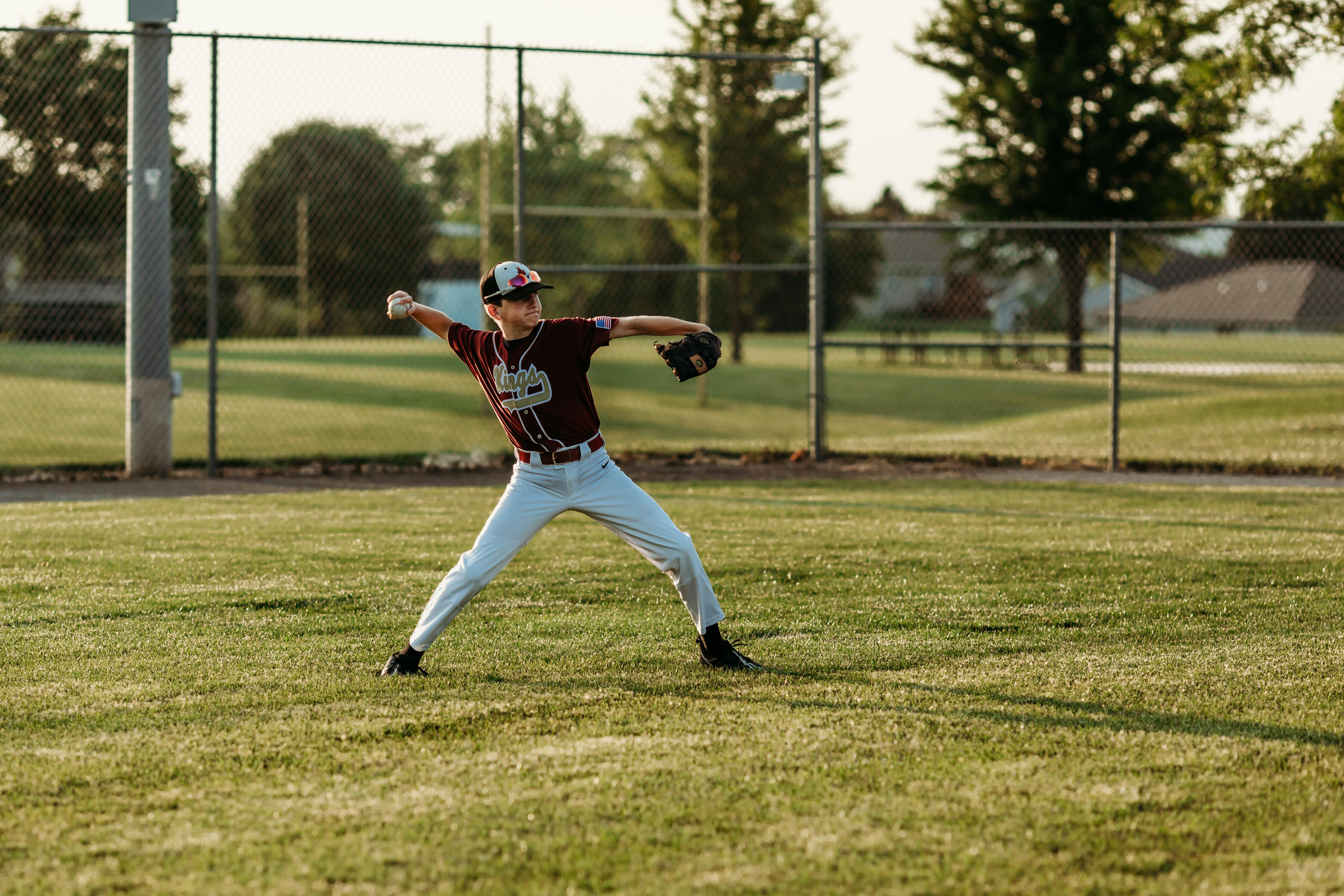 Boy in Uniform Playing Baseball on Field · Free Stock Photo