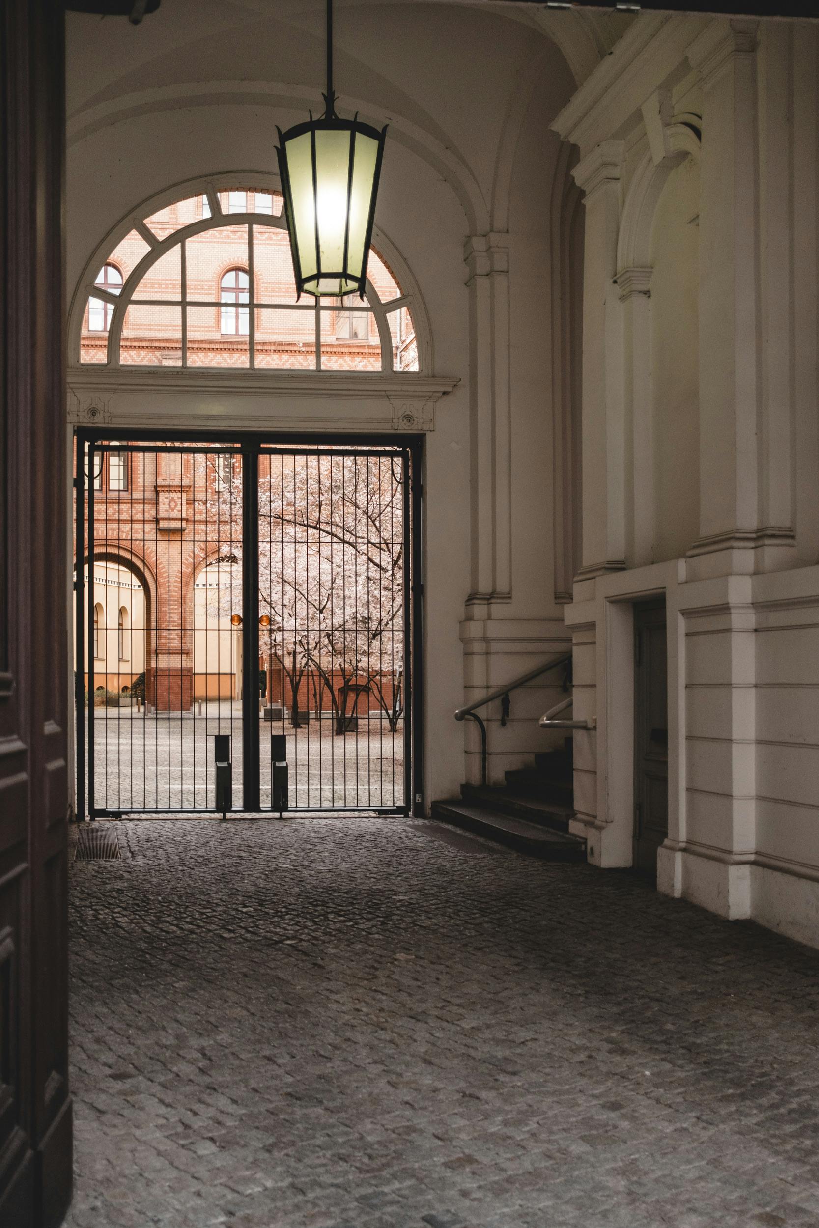 An Arched Gate to a Traditional Building · Free Stock Photo