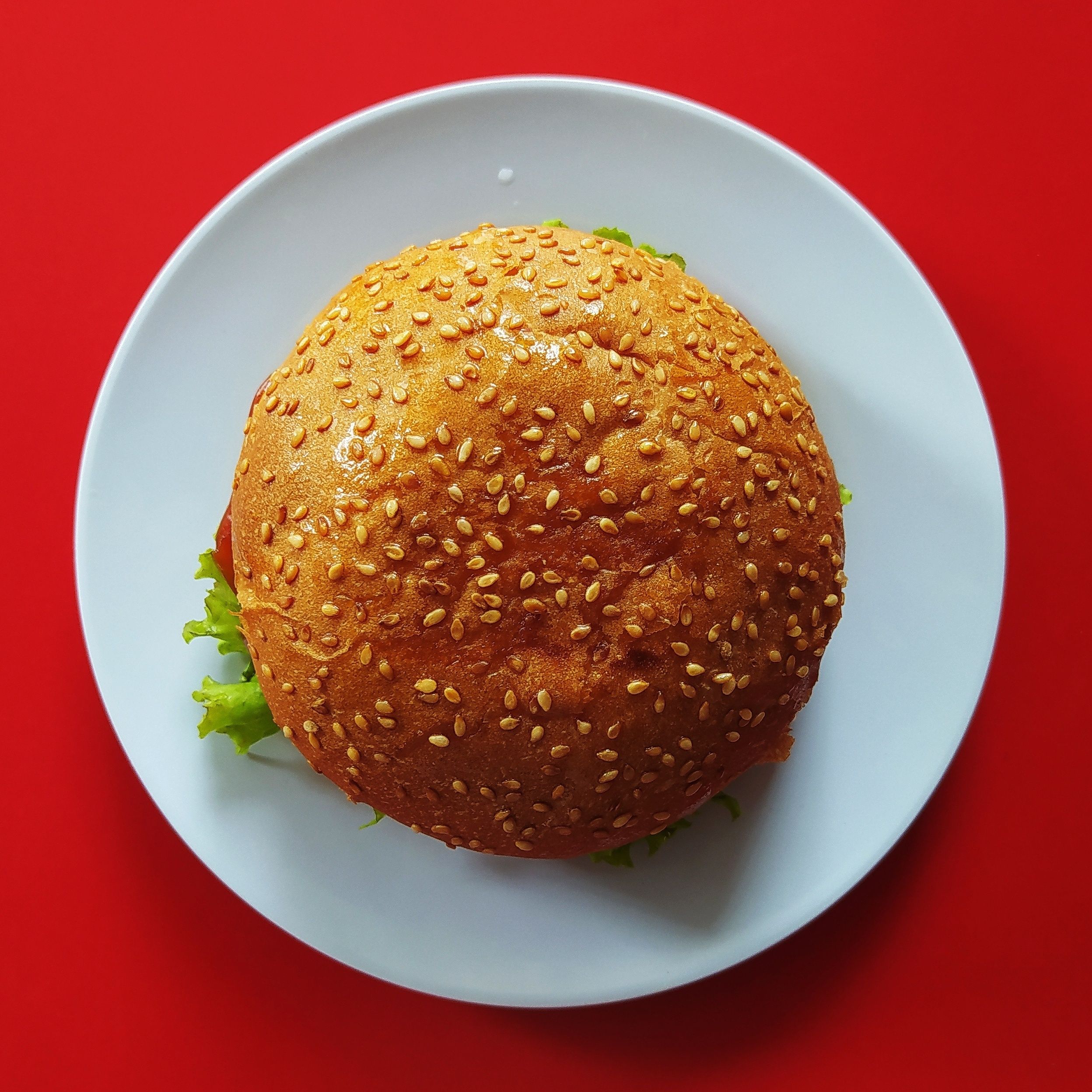 Close-Up of a Hamburger on Black Background · Free Stock Photo