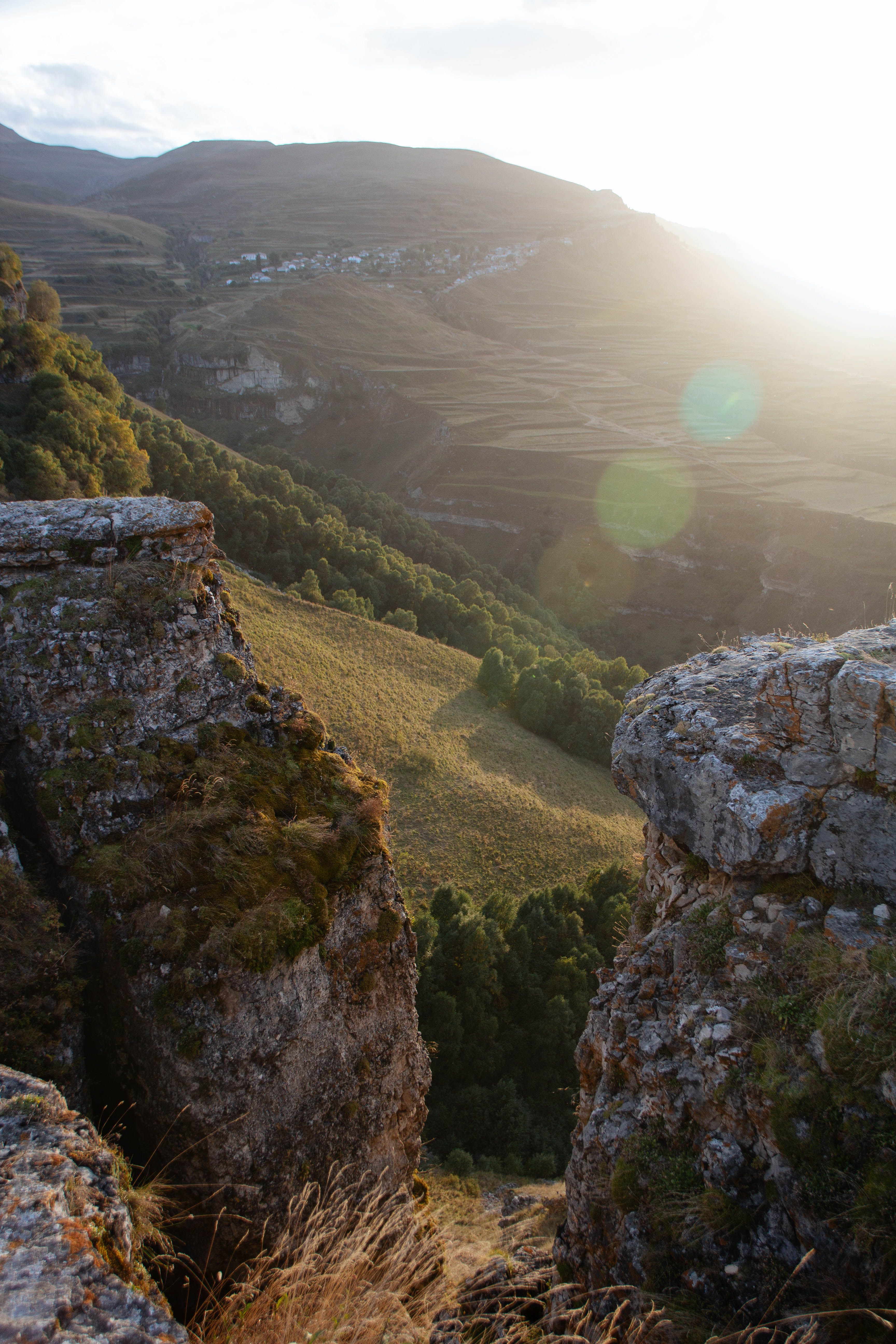Sunlight over Rocks and Hill behind · Free Stock Photo