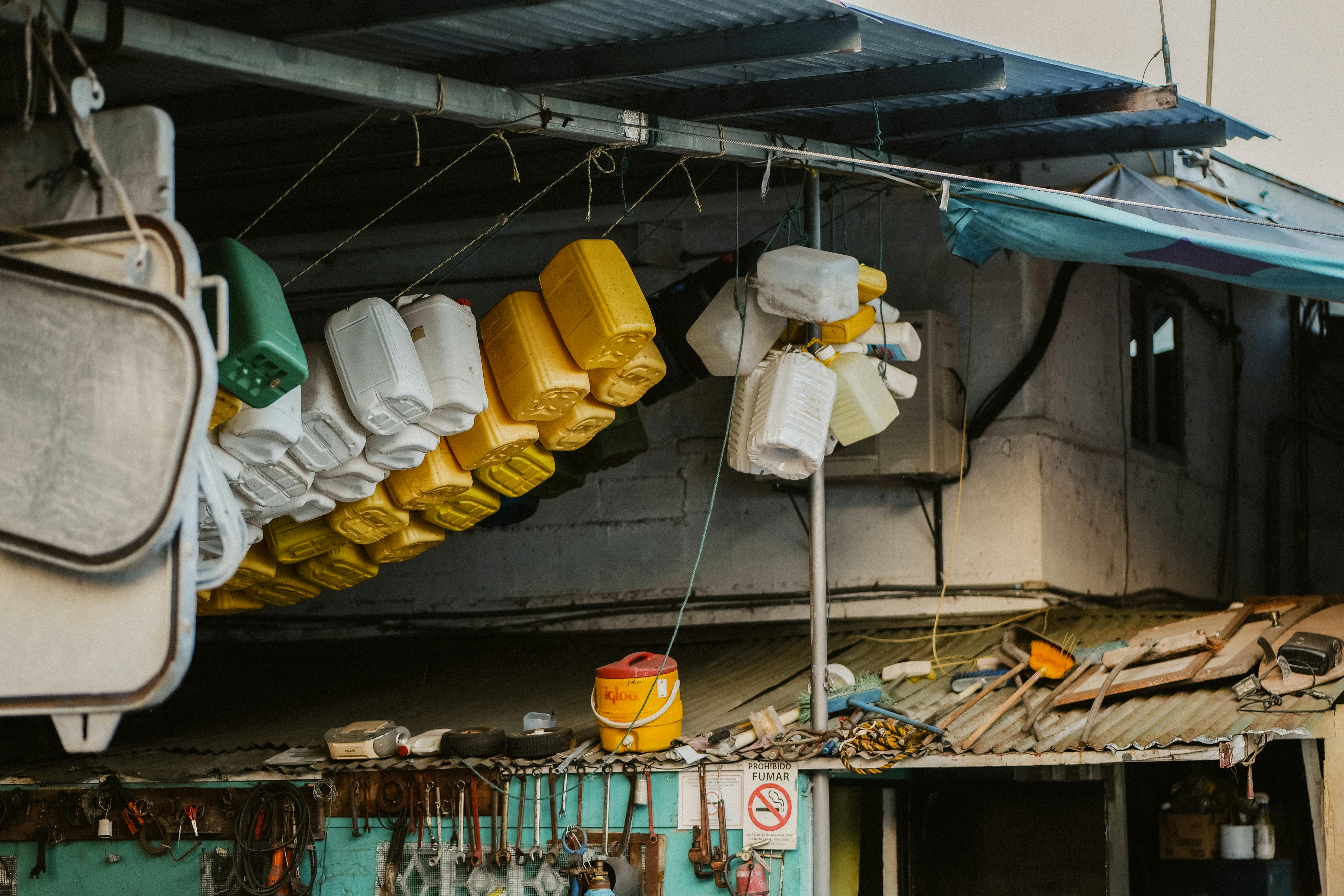 Containers Hanging under Ceiling at Bazaar · Free Stock Photo