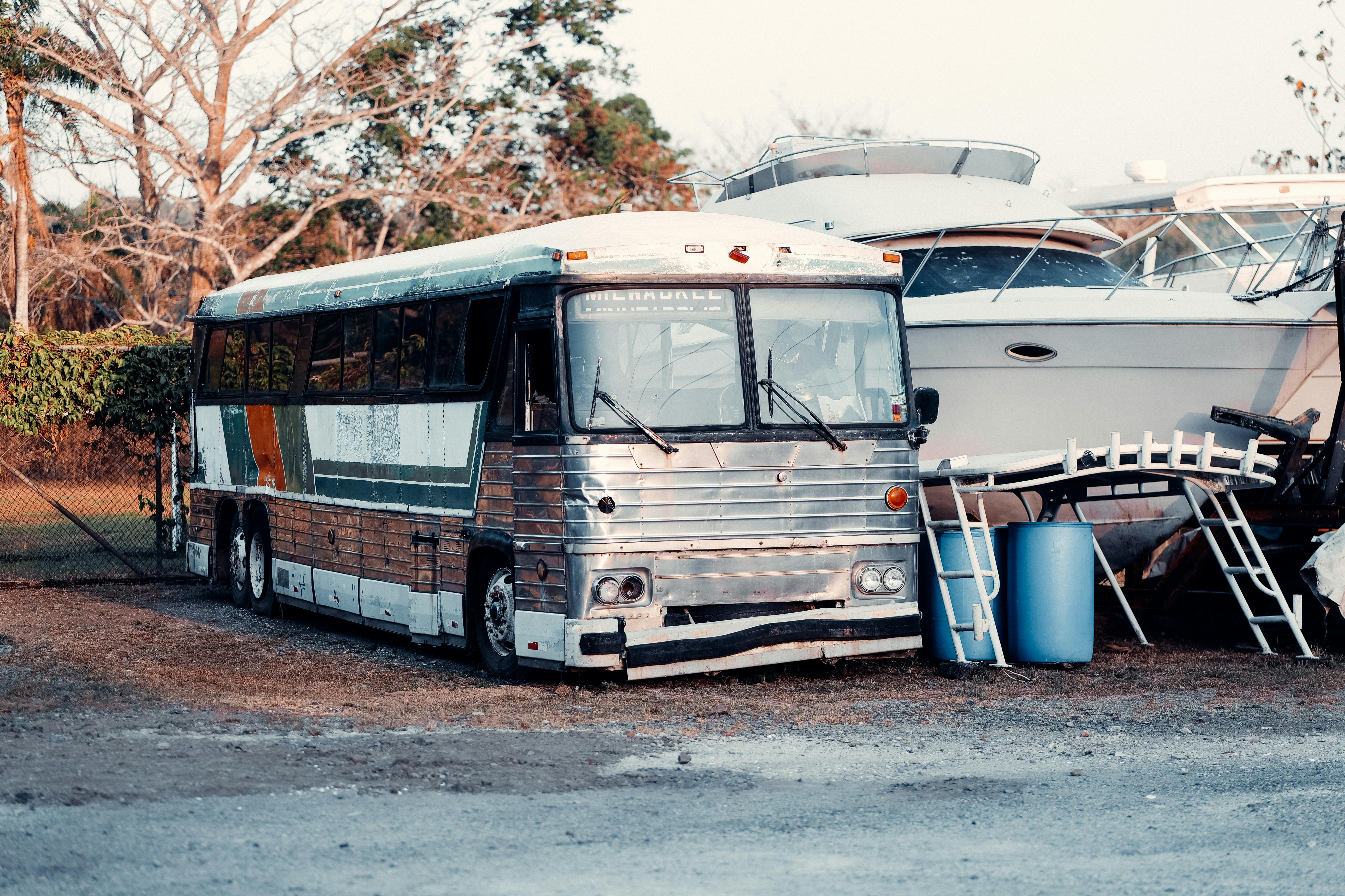 Bus Wreck near Yacht · Free Stock Photo