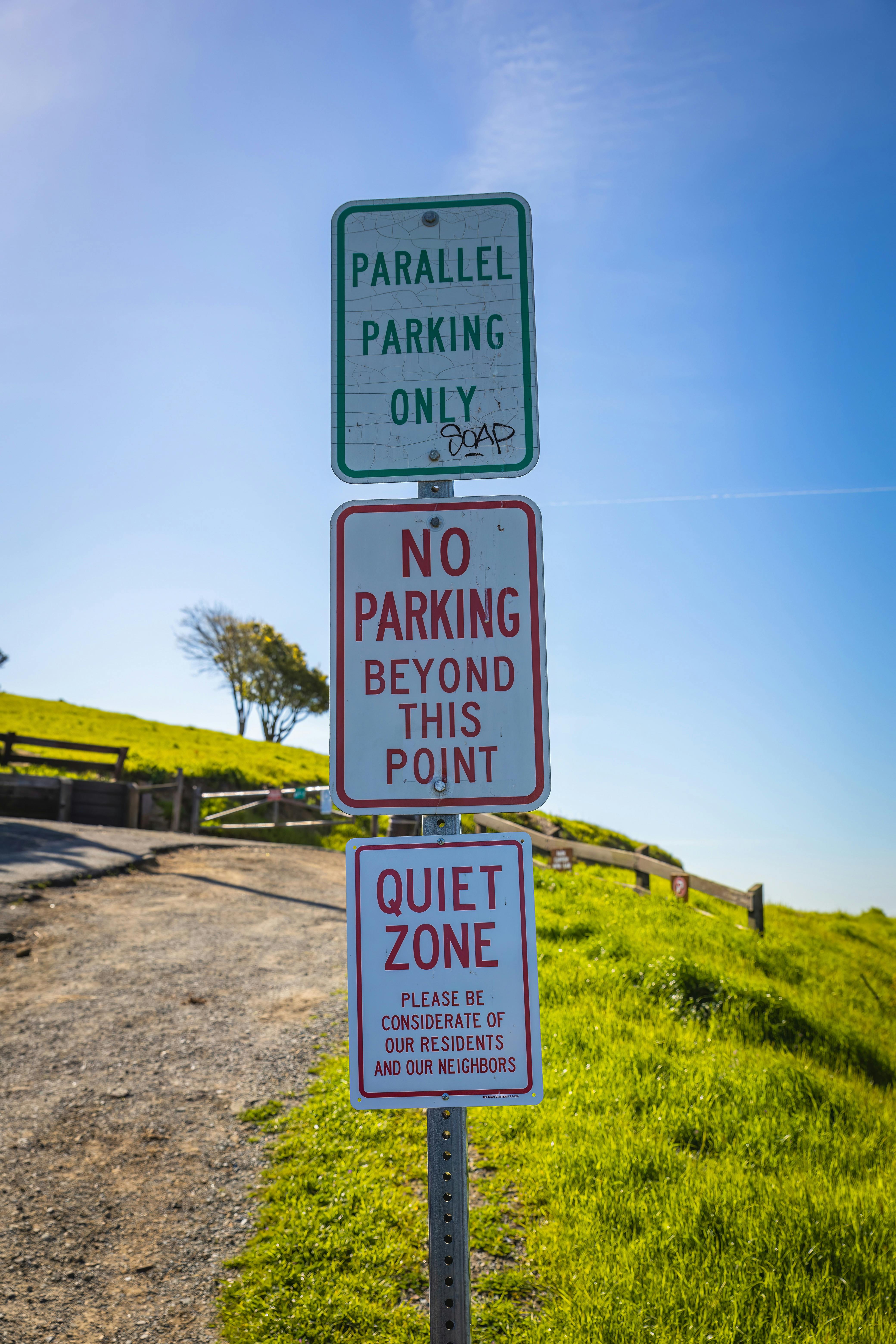 Road Signs by Dirt Road · Free Stock Photo