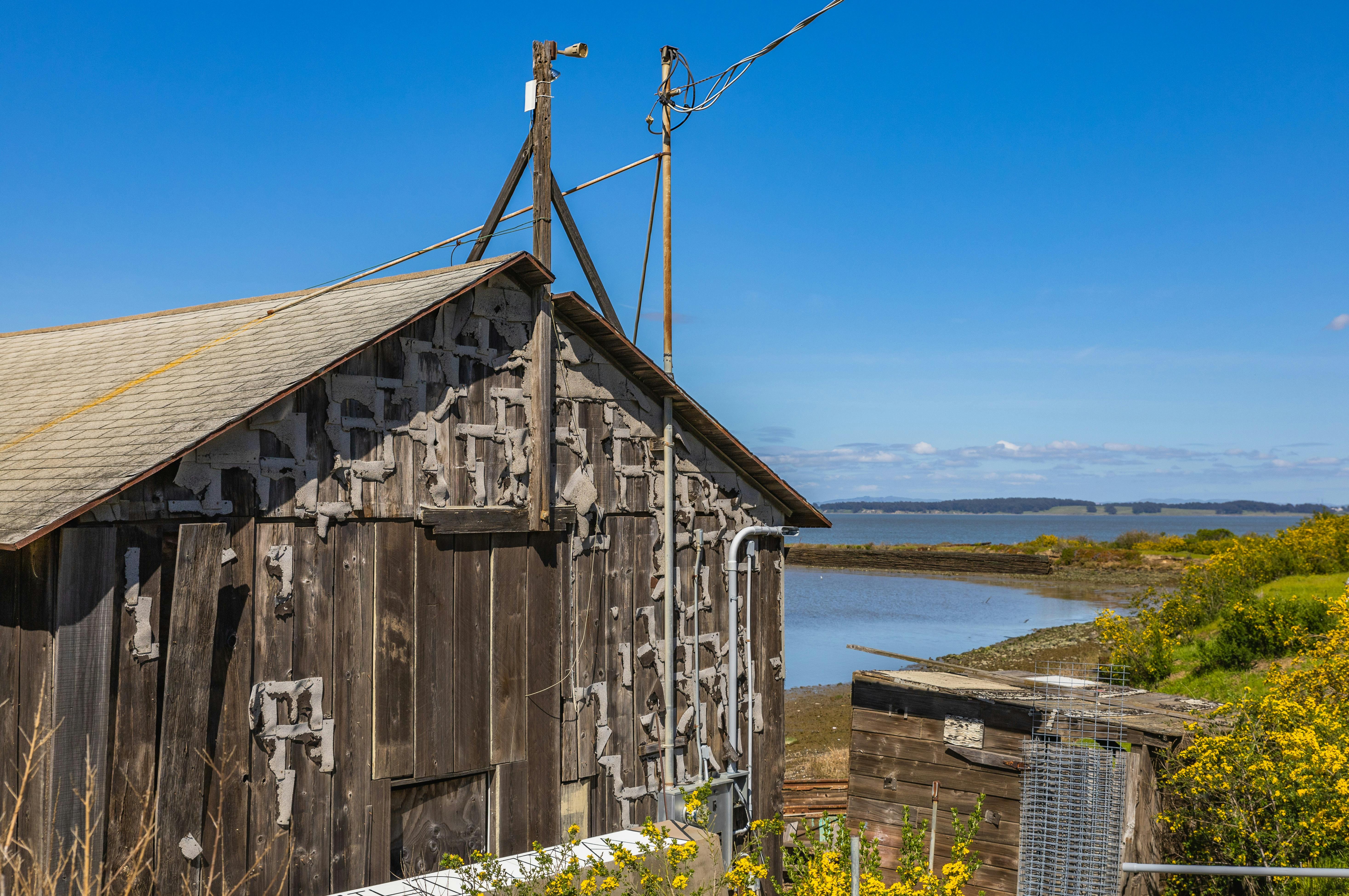 Wooden House on Pier on Sea Shore · Free Stock Photo