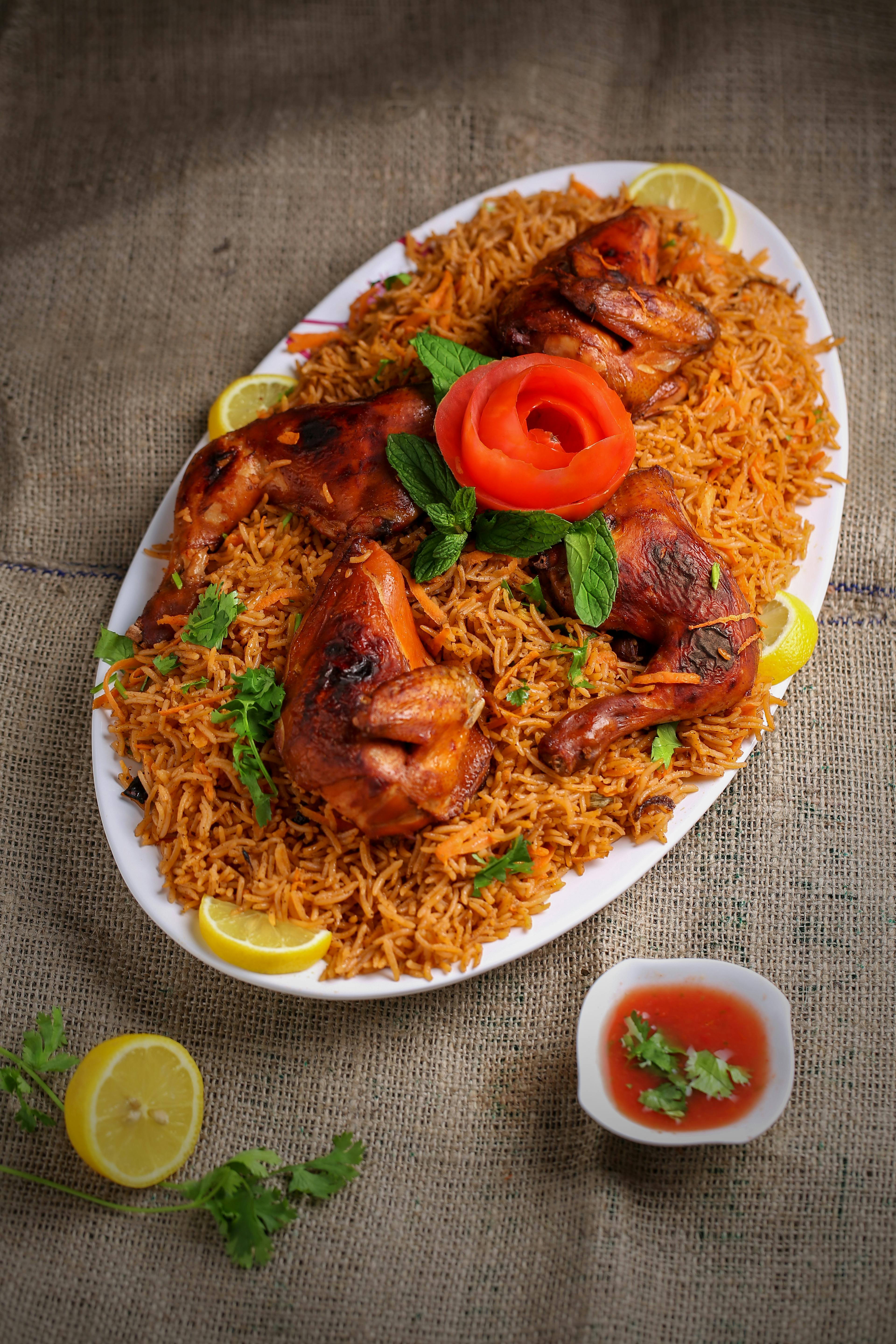 Cooked Rice With Chicken Served On White Platter · Free Stock Photo