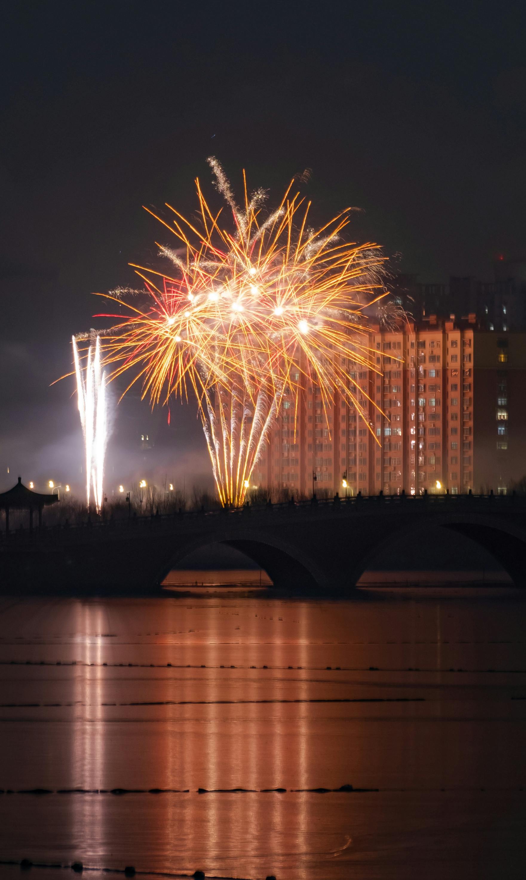 Fireworks Display Near High Rise Buildings during Nighttime · Free ...