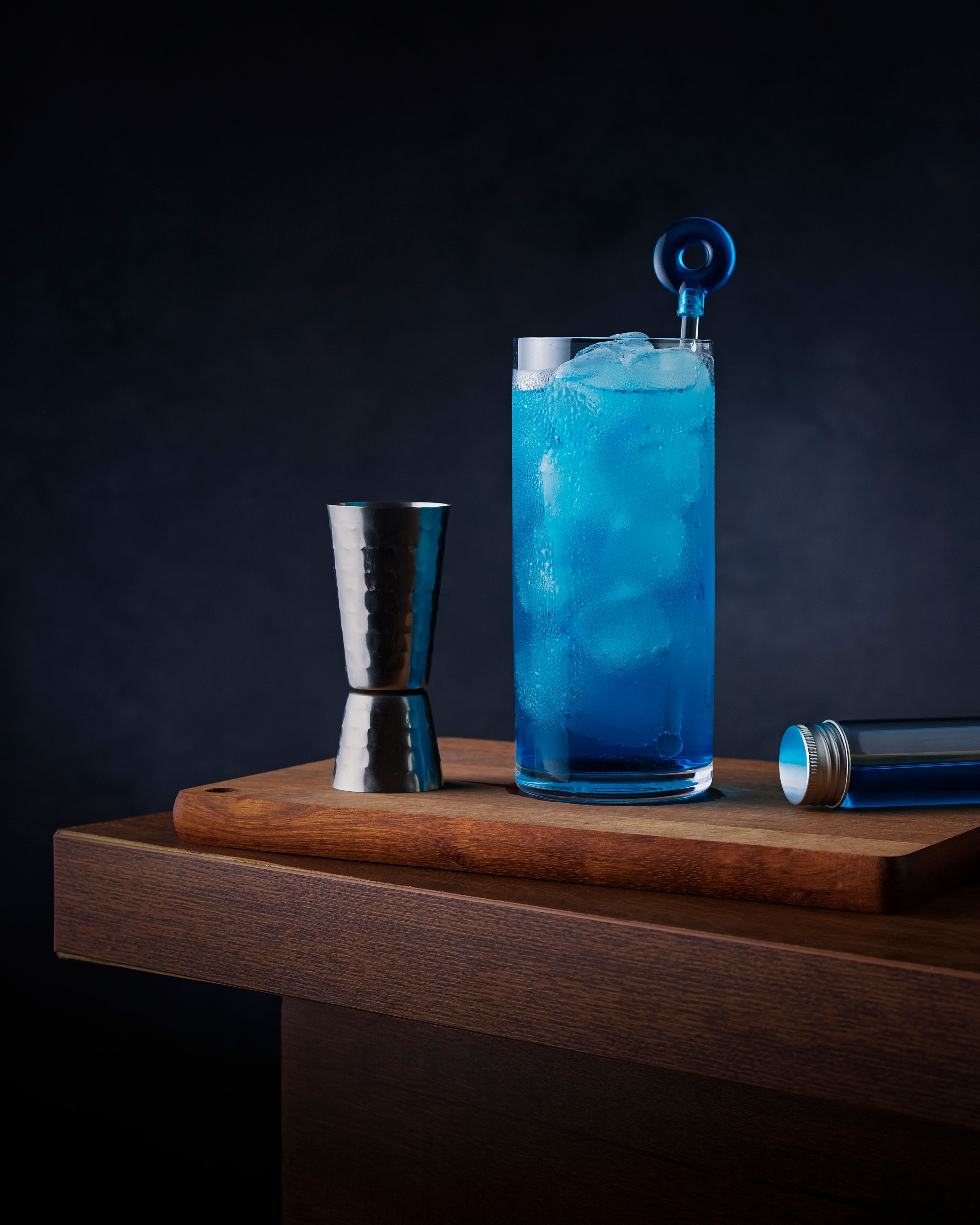 Vibrant Blue Cocktail with Bar Accessories · Free Stock Photo