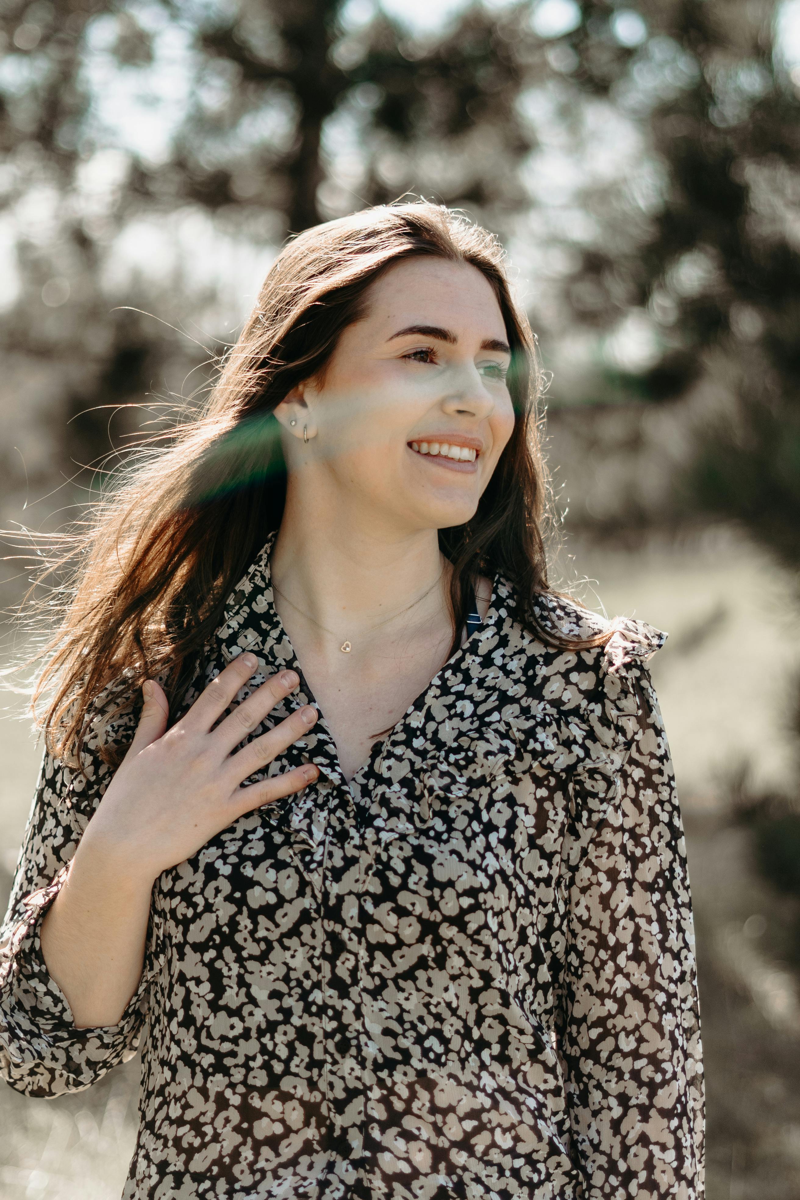 Smiling Woman with Hair Raised Up · Free Stock Photo
