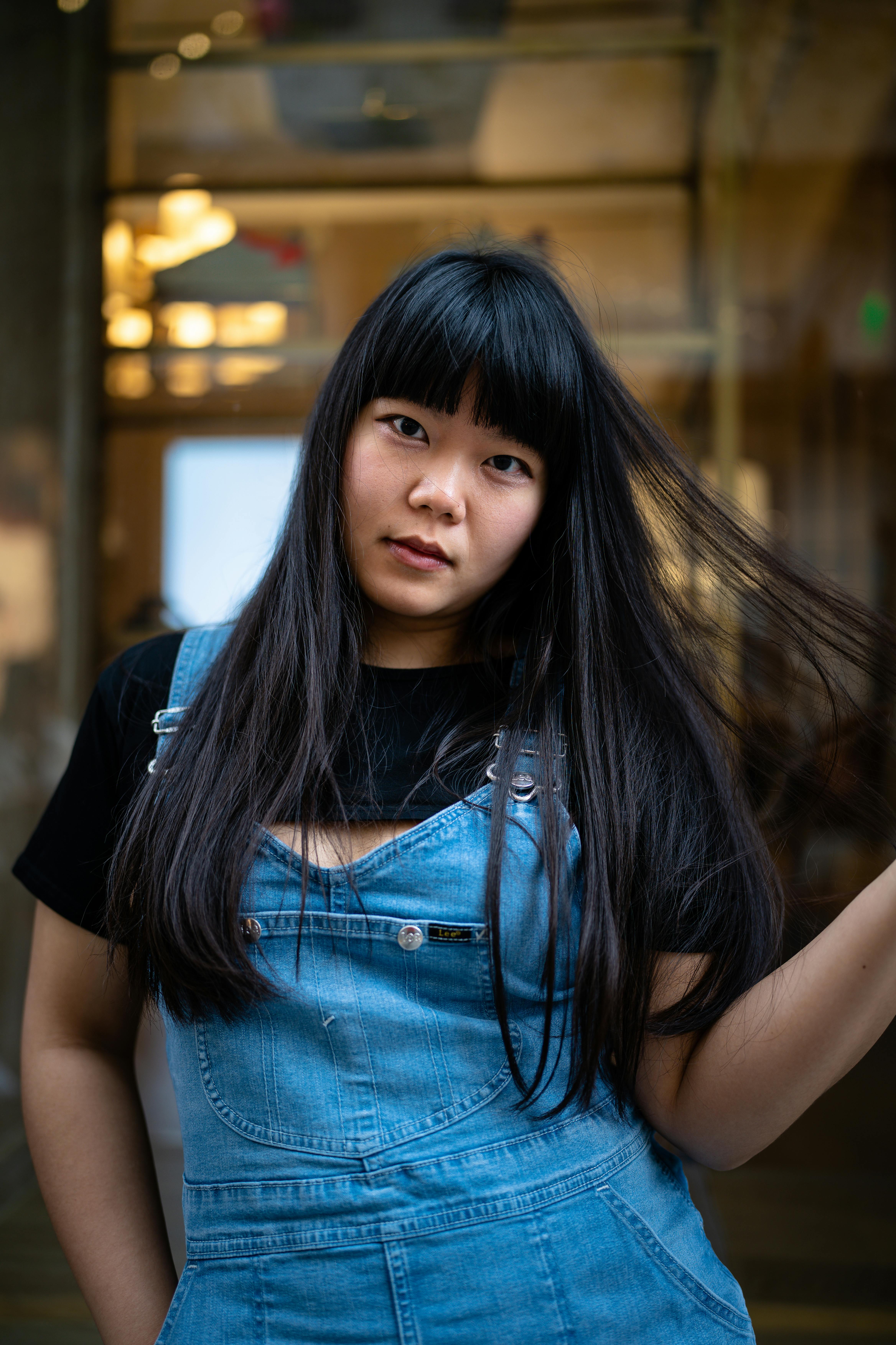 Portrait of Woman in Denim Overalls Indoors · Free Stock Photo