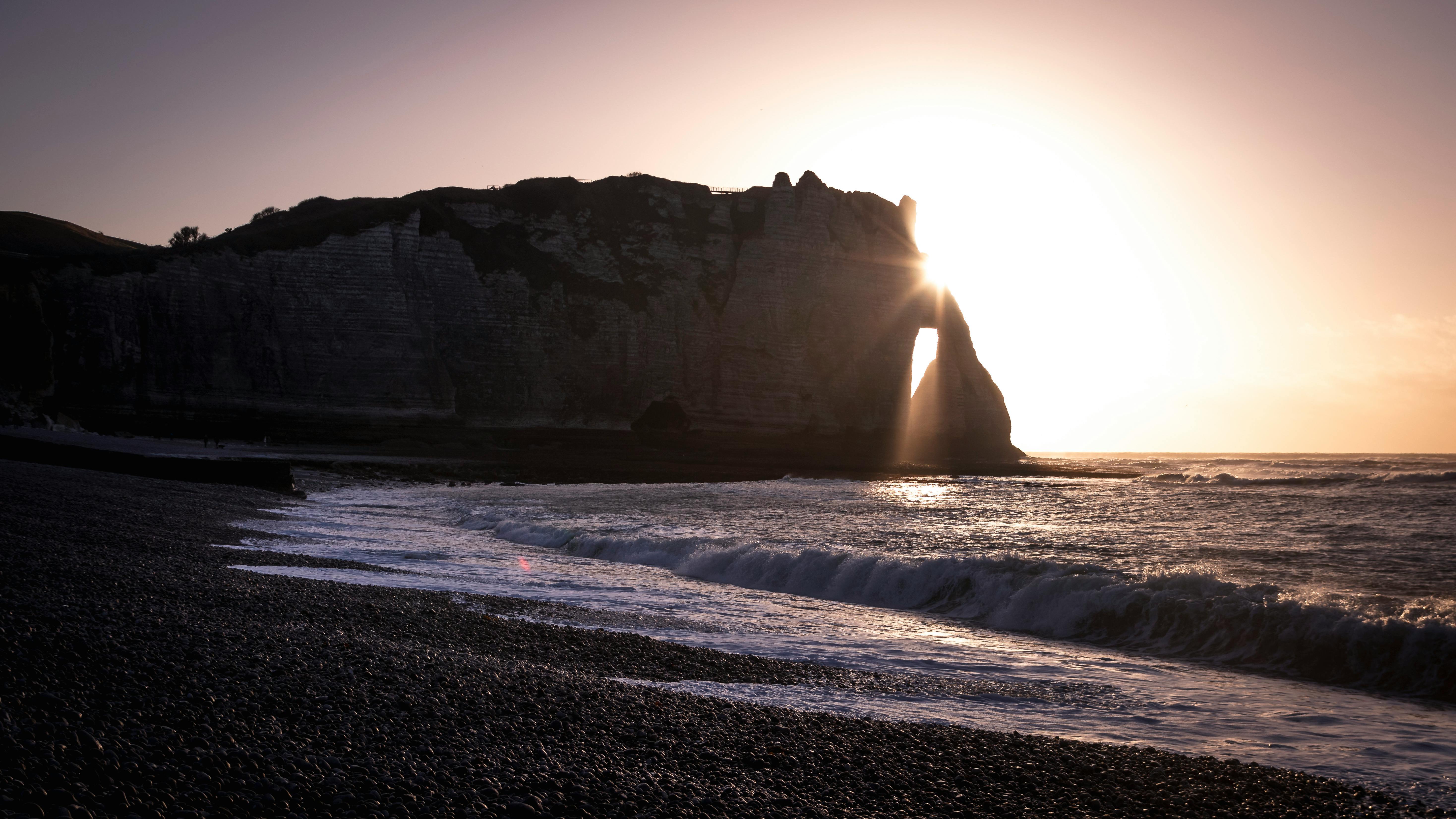 Beach and Cliffs at Sunset · Free Stock Photo
