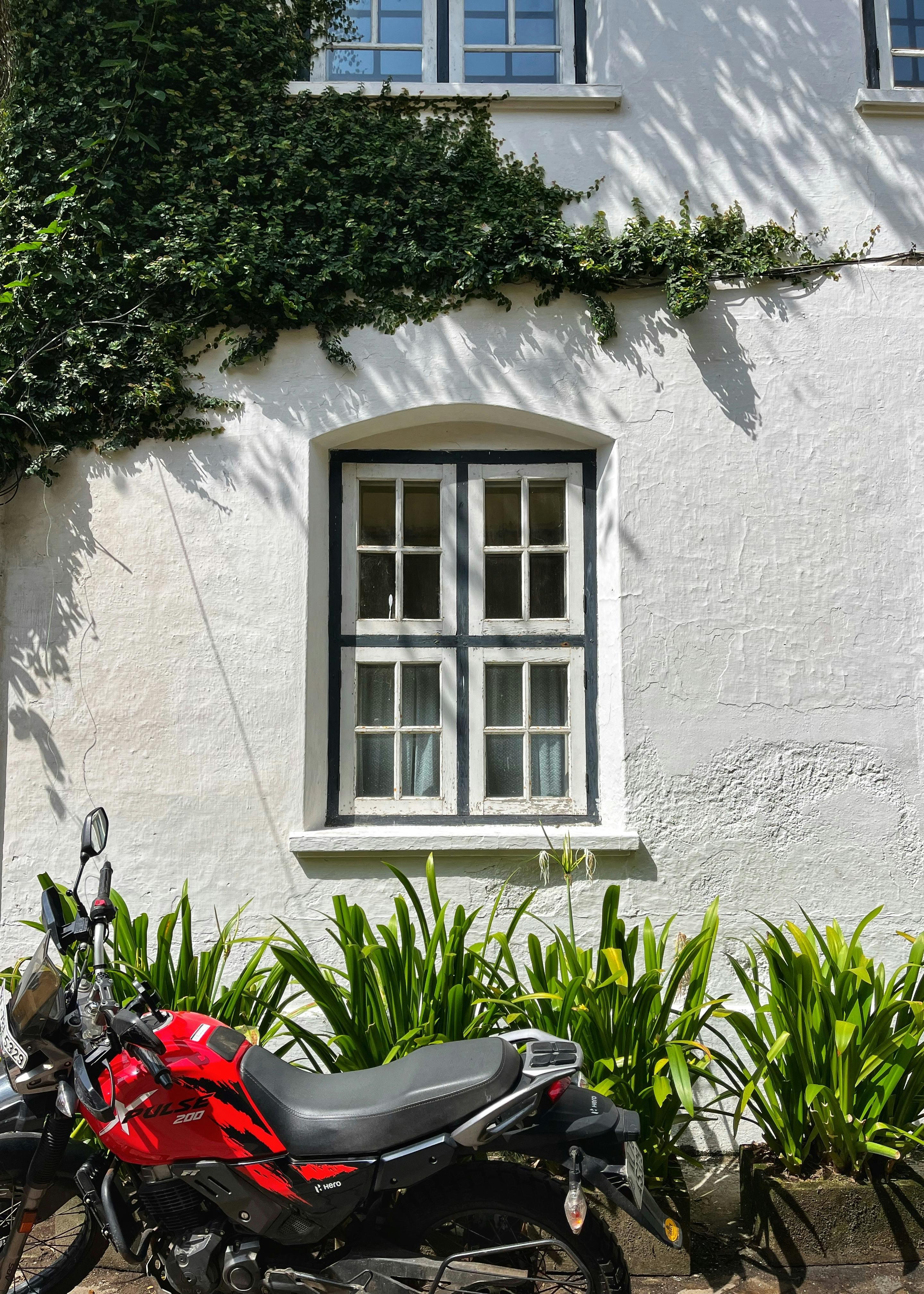 Motorbike Parked by House · Free Stock Photo