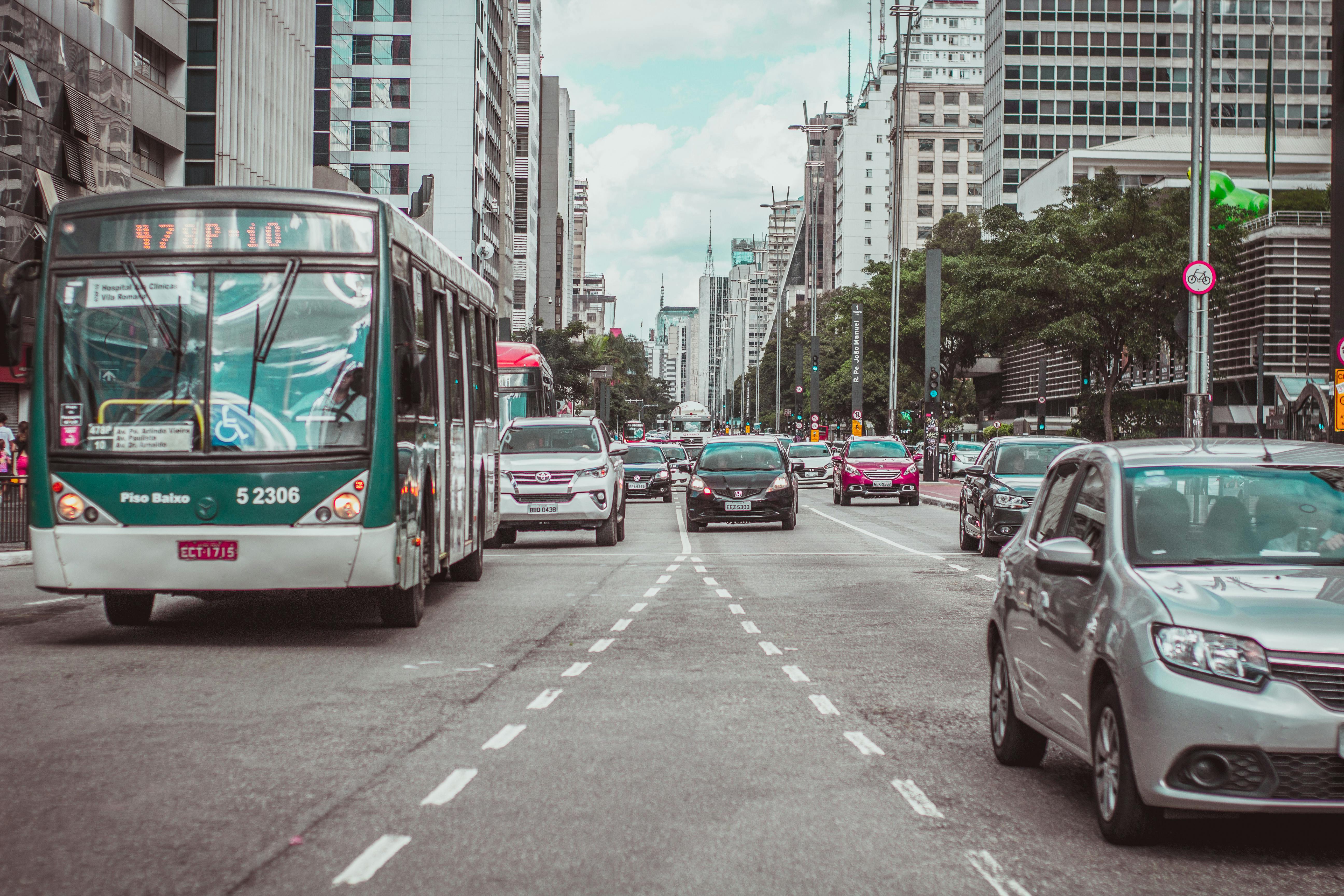 Two White Bus Near Side Walk · Free Stock Photo