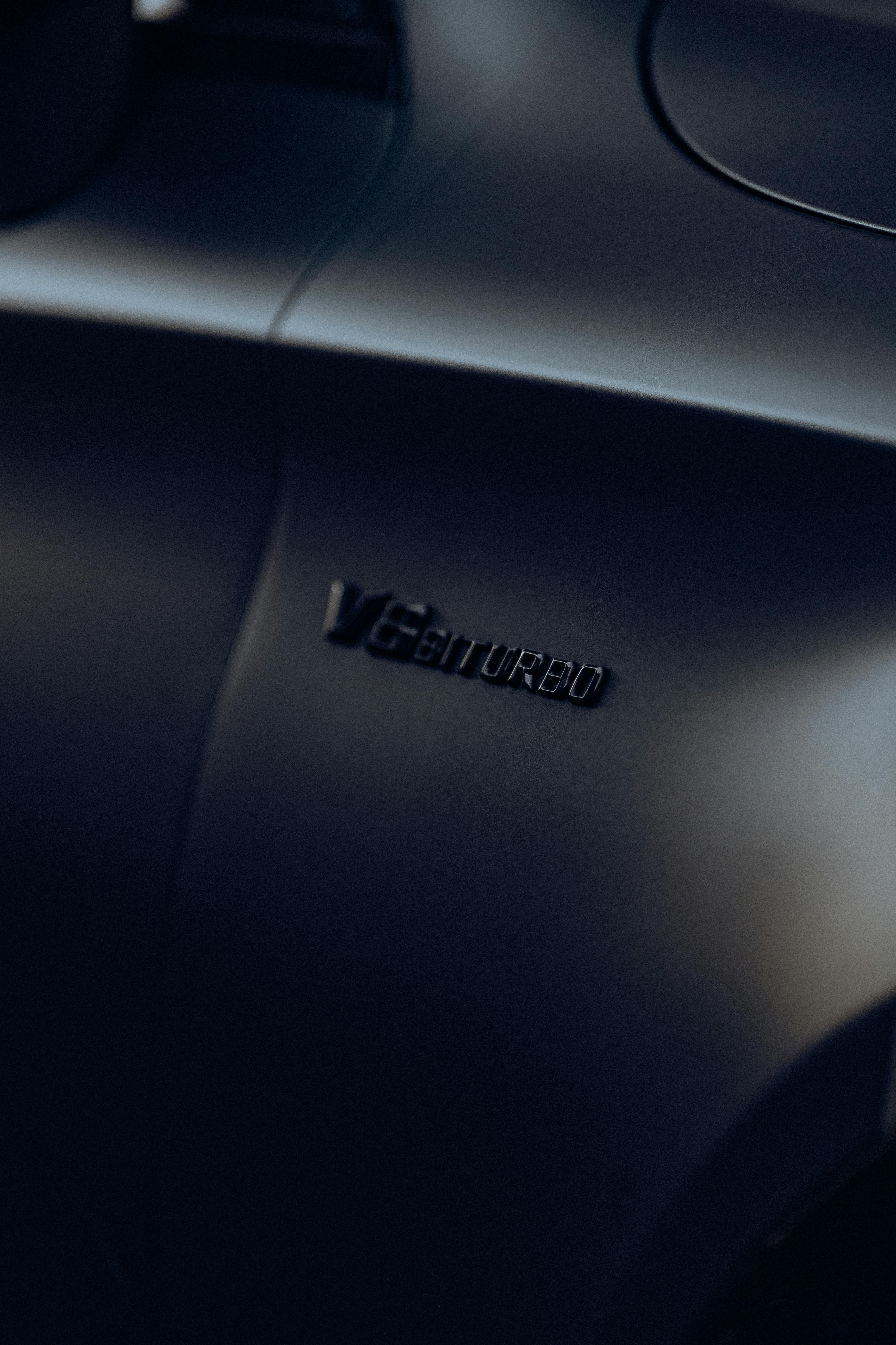 V6 Logo on Metallic Car · Free Stock Photo