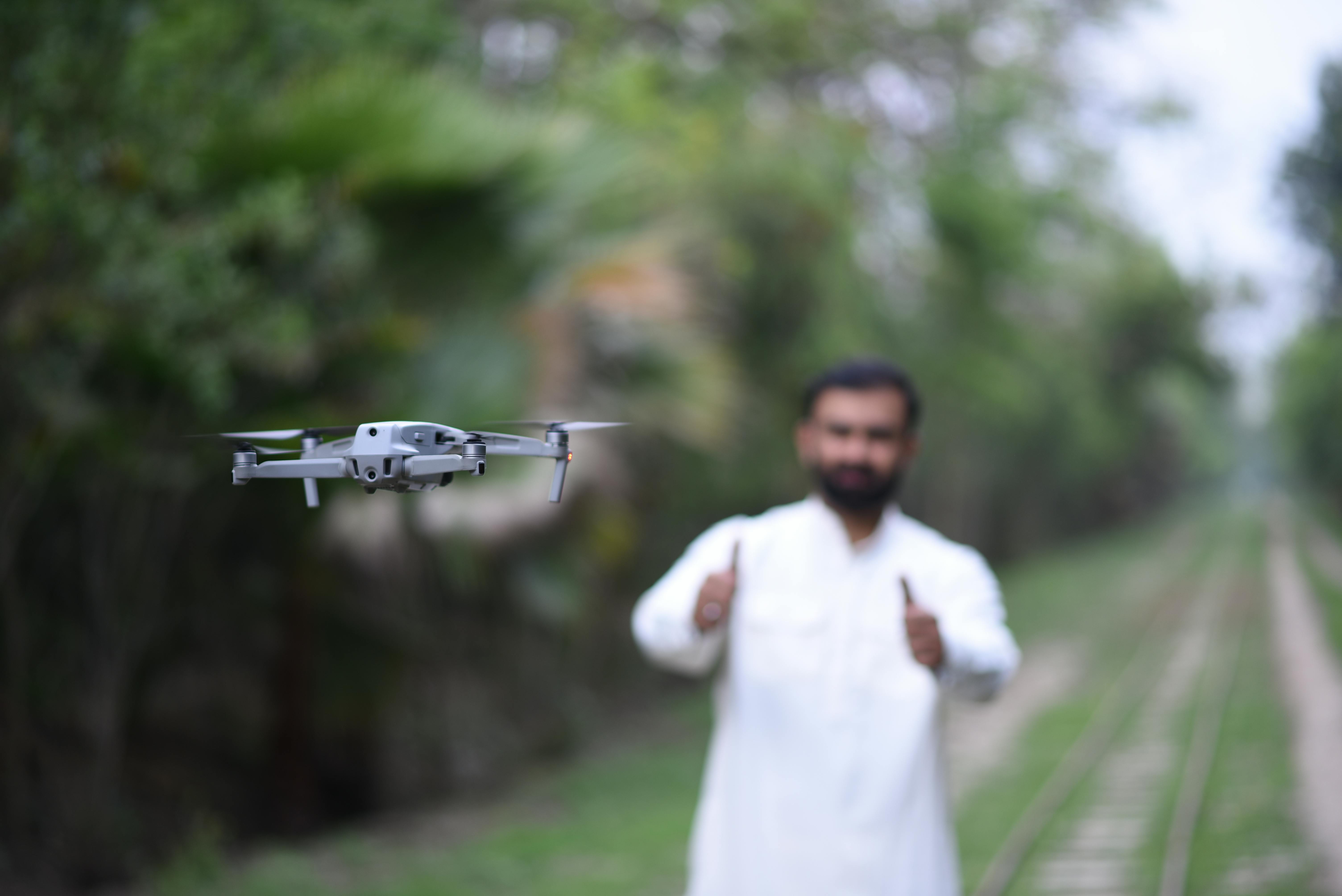 A Drone Taking a Photo of a Man · Free Stock Photo