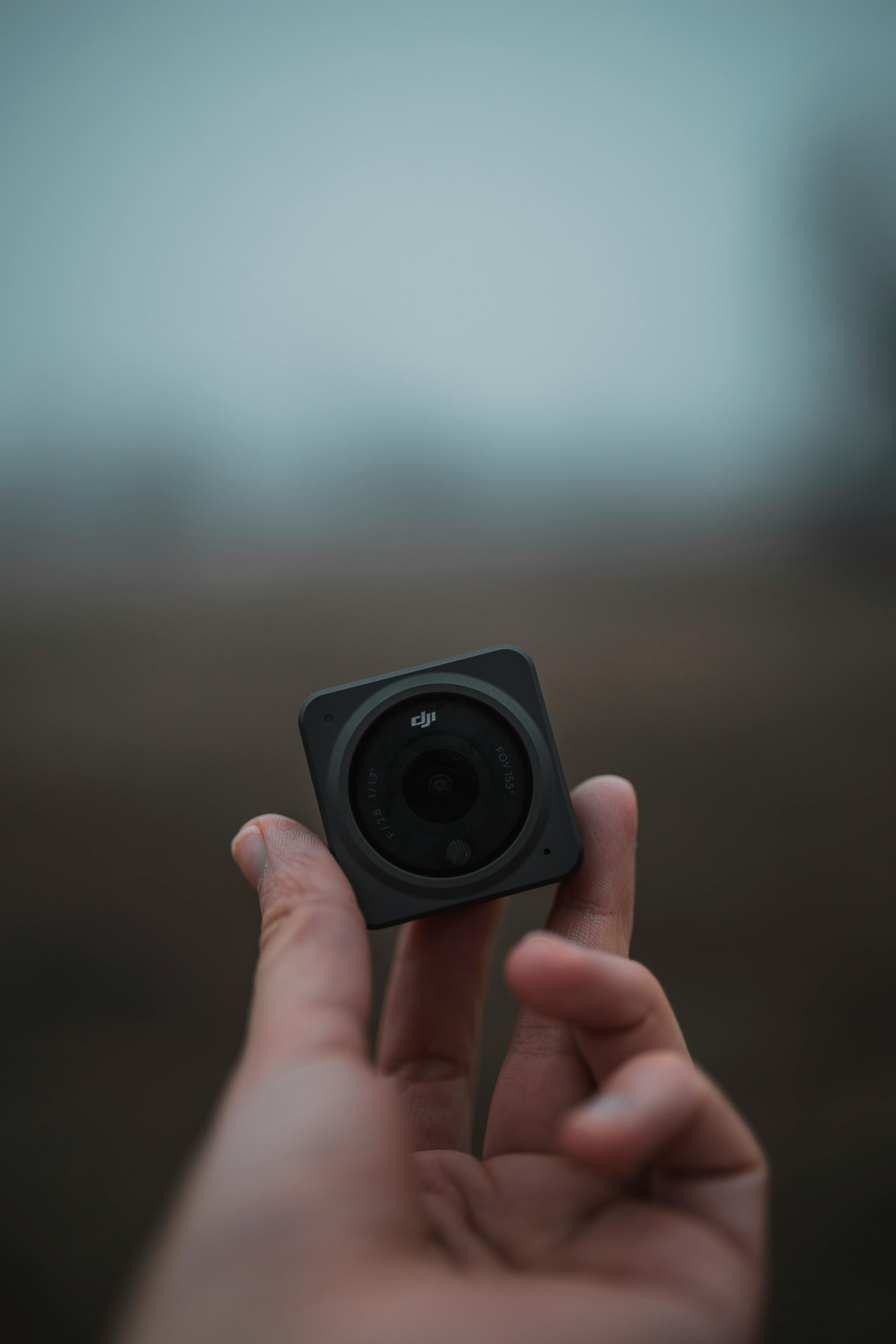 Hand Holding DJI Action Camera · Free Stock Photo