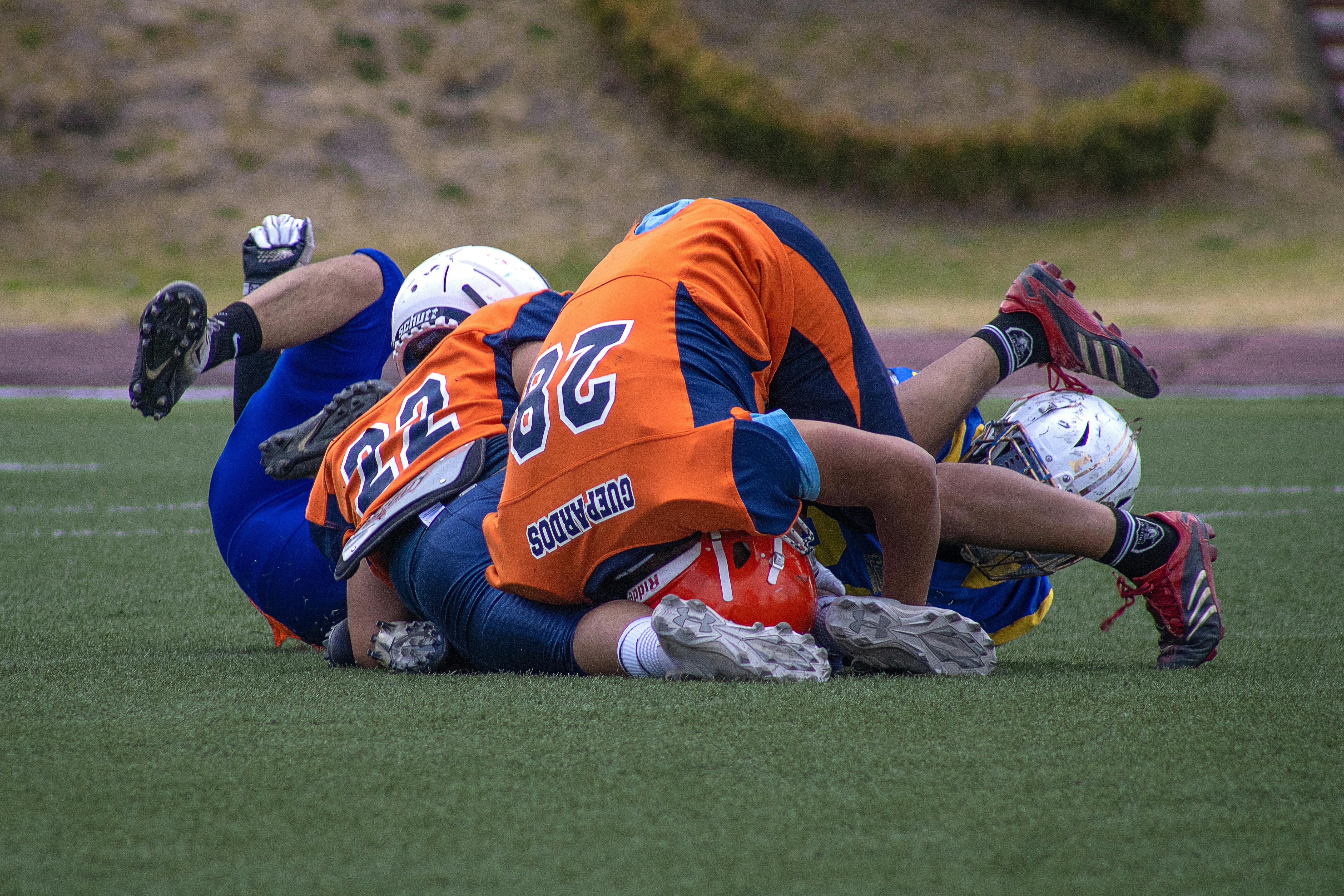 Back View of American Footballers · Free Stock Photo