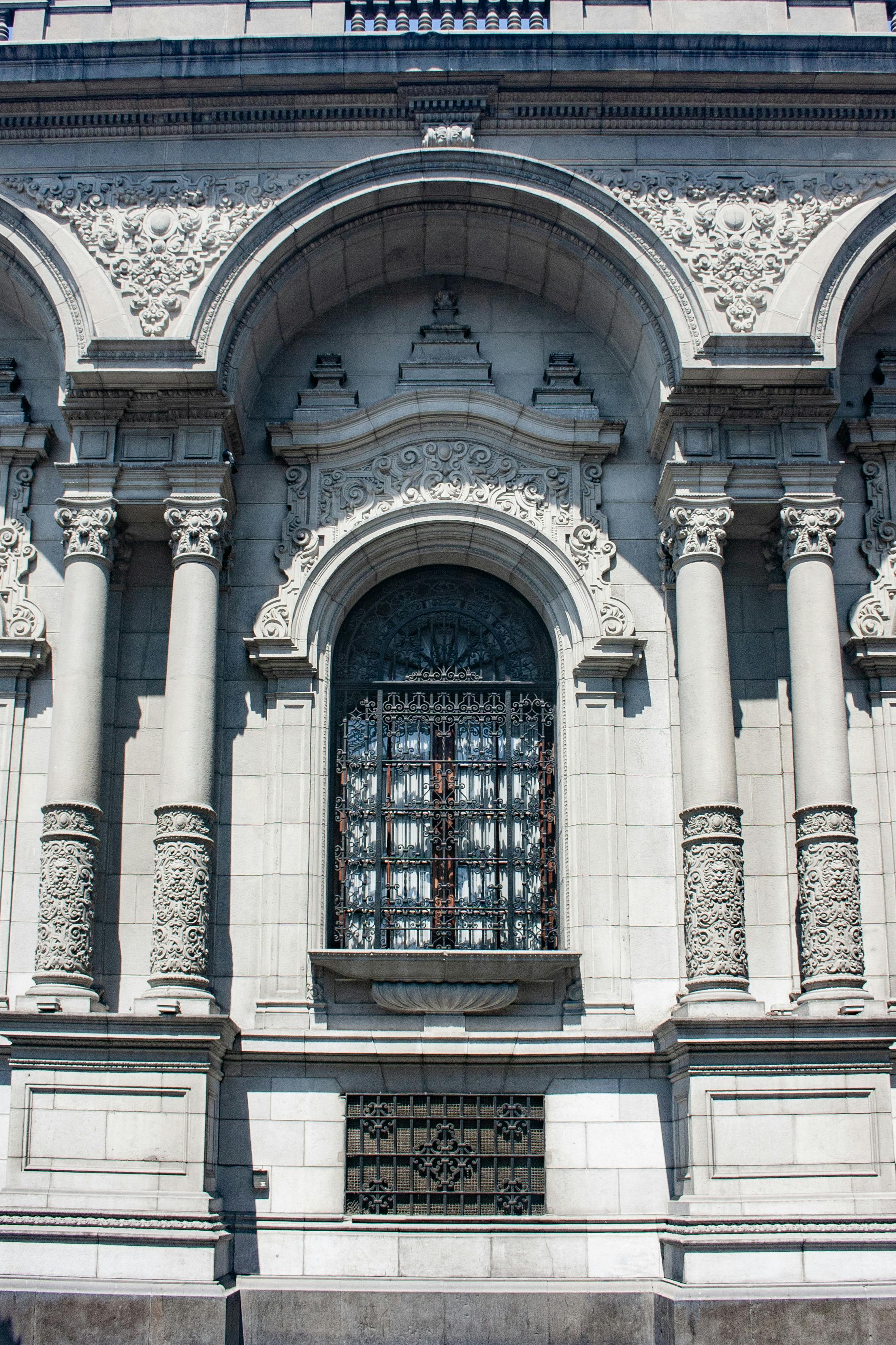 Ornamented Building Wall with Columns and Reliefs · Free Stock Photo