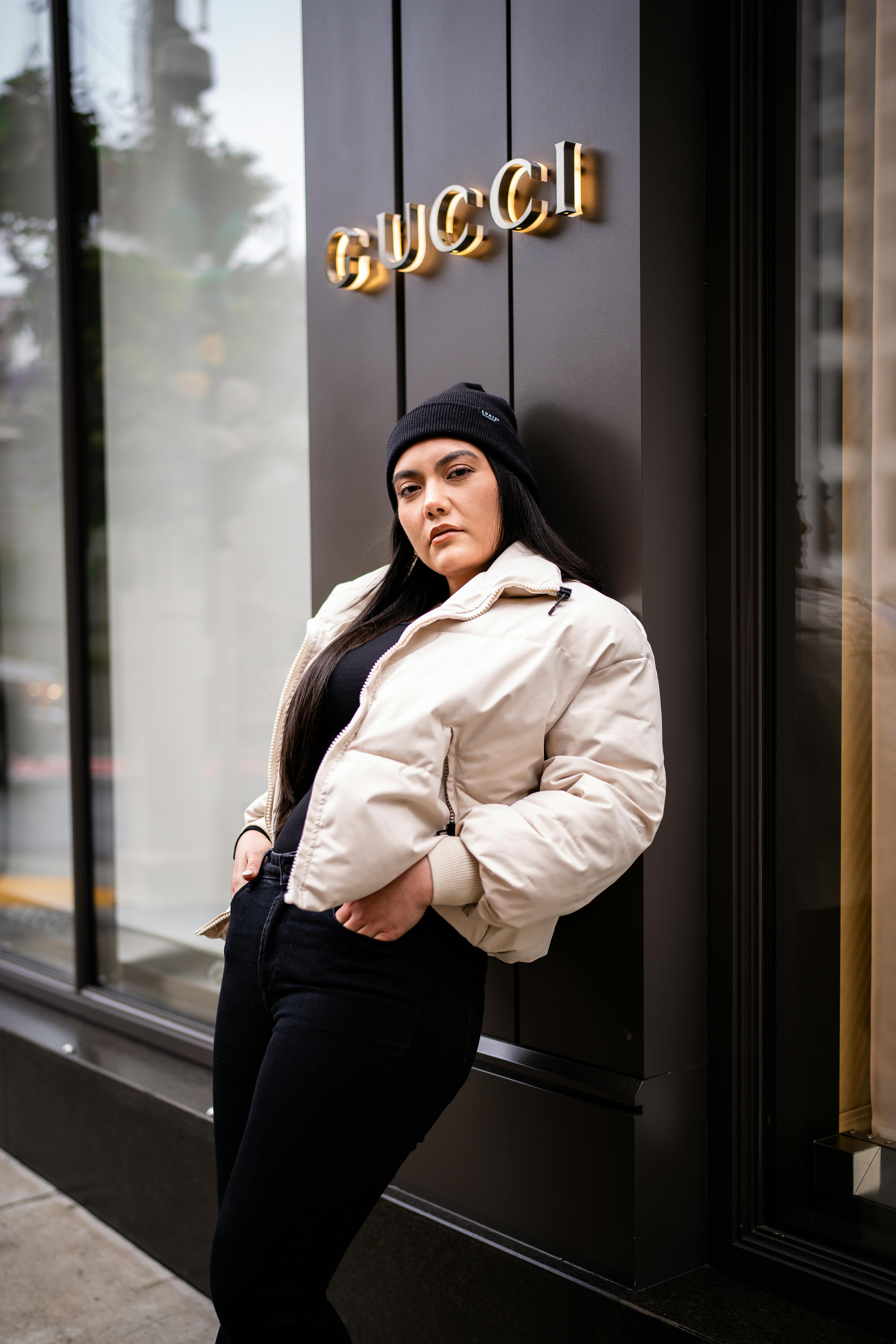 Woman Posing by Wall of Gucci Store · Free Stock Photo