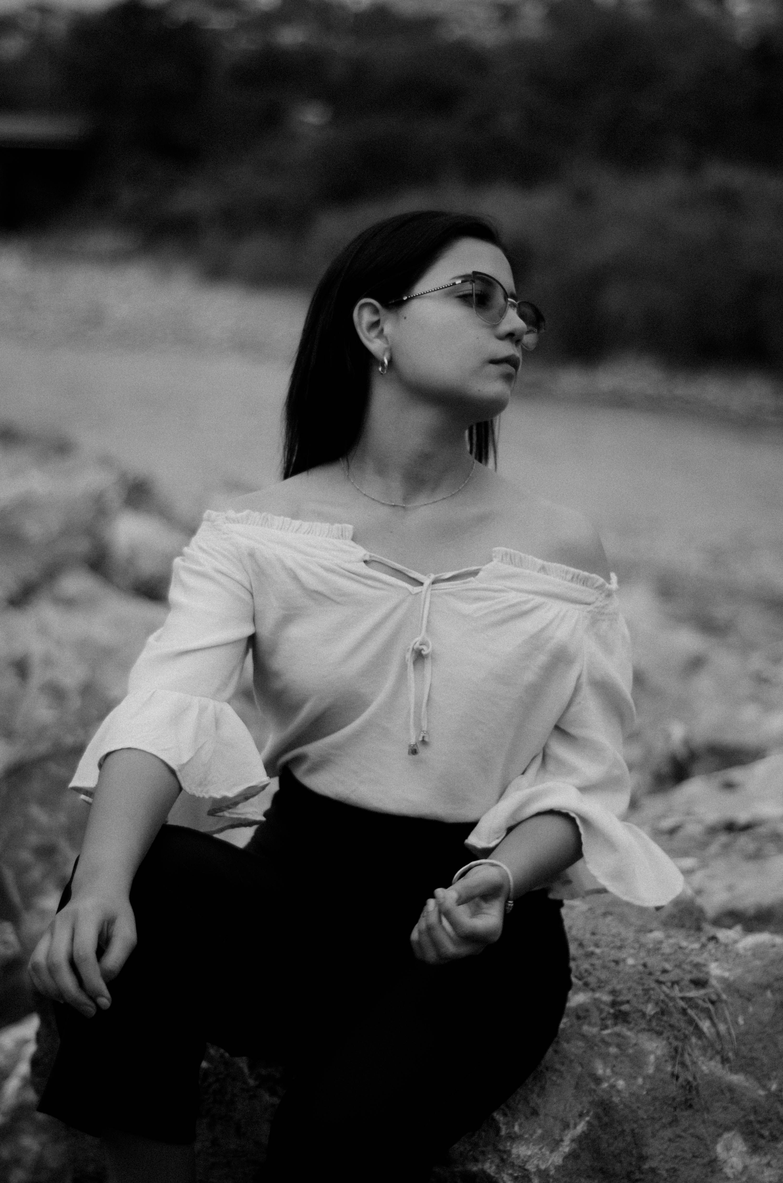 Model Posing in Off Shoulder Black Bodysuit · Free Stock Photo