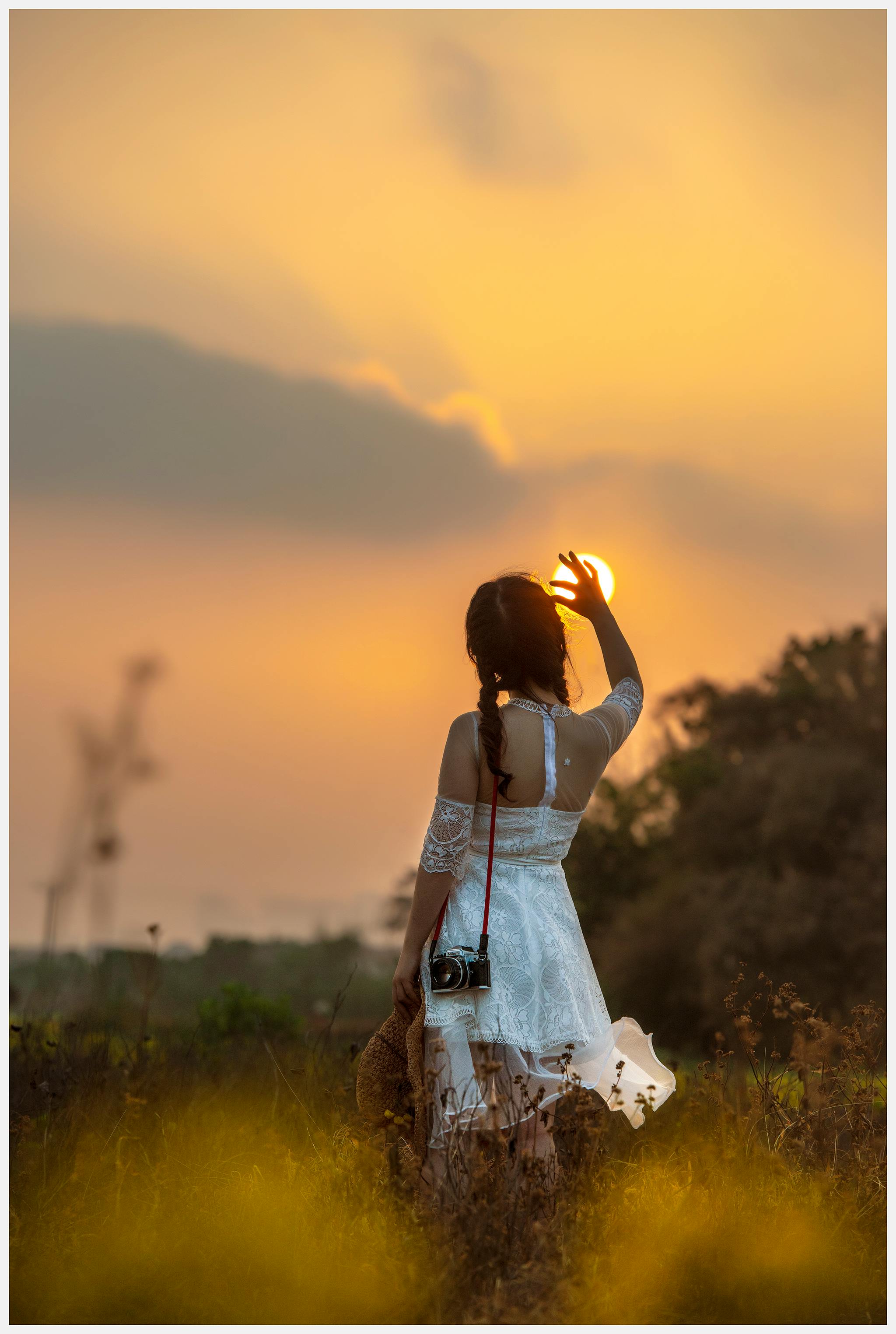 Woman in Dress on Meadow at Sunset · Free Stock Photo