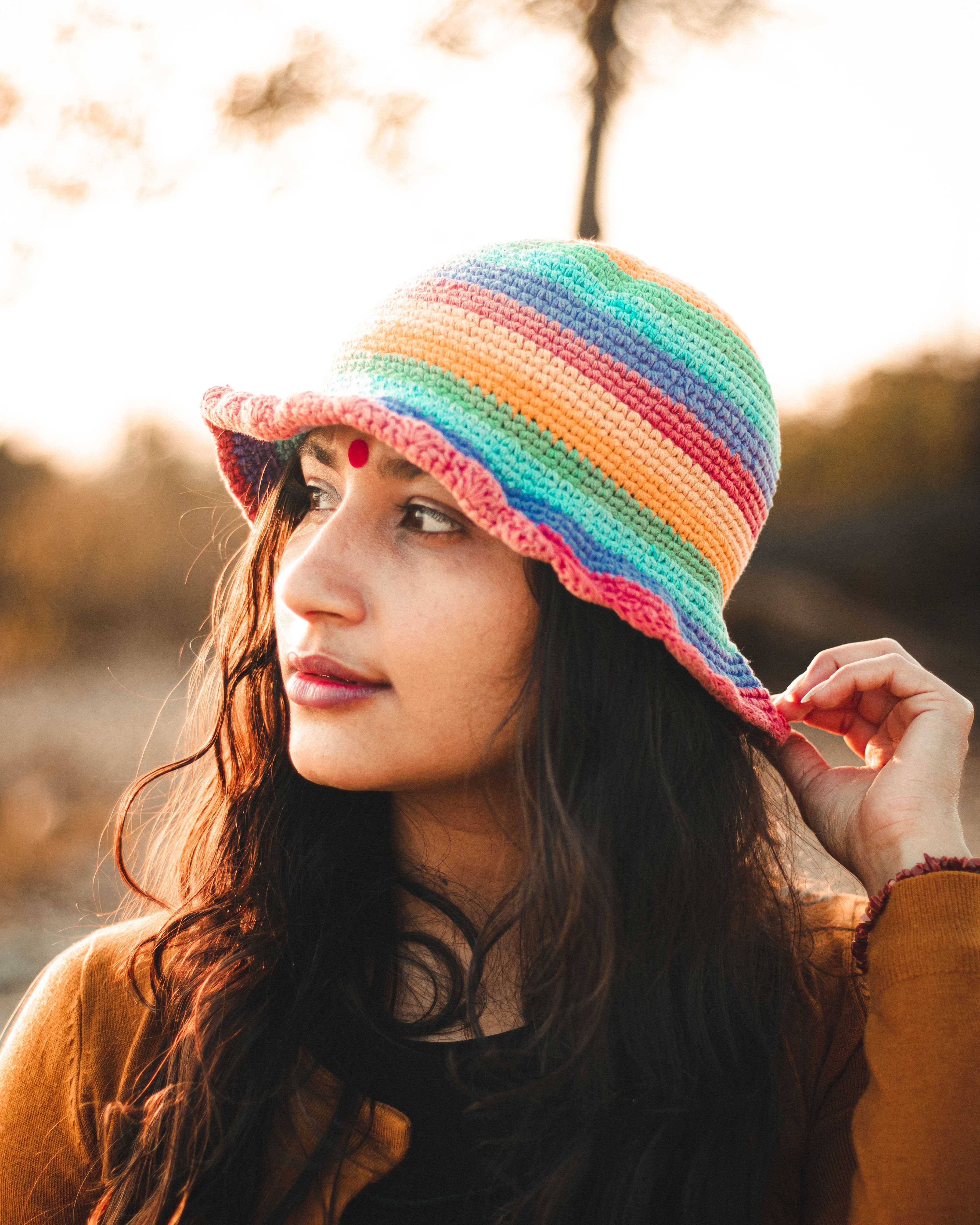 Woman Posing in Colorful Hat · Free Stock Photo