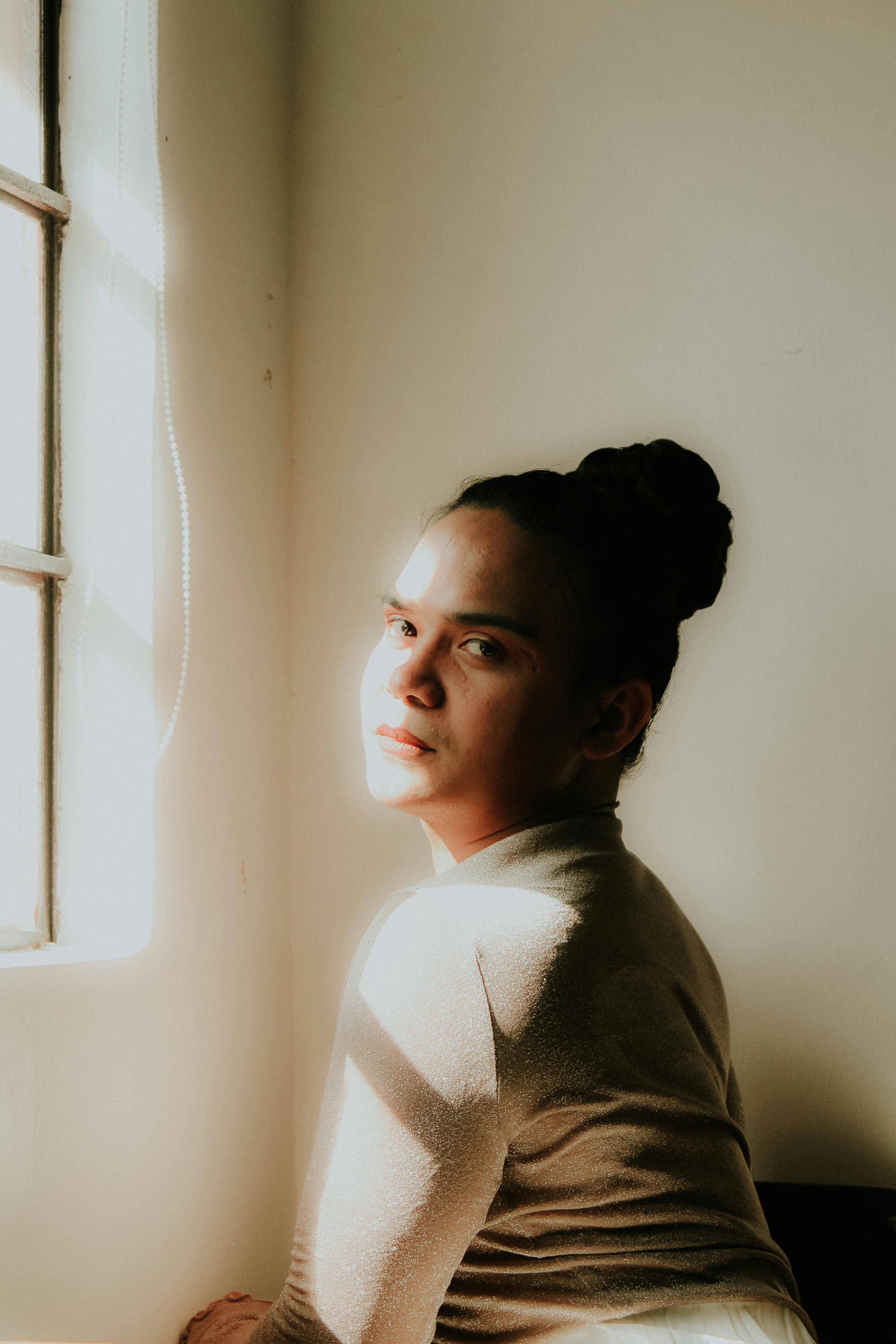 Sunlit Face of Woman Turning Back · Free Stock Photo