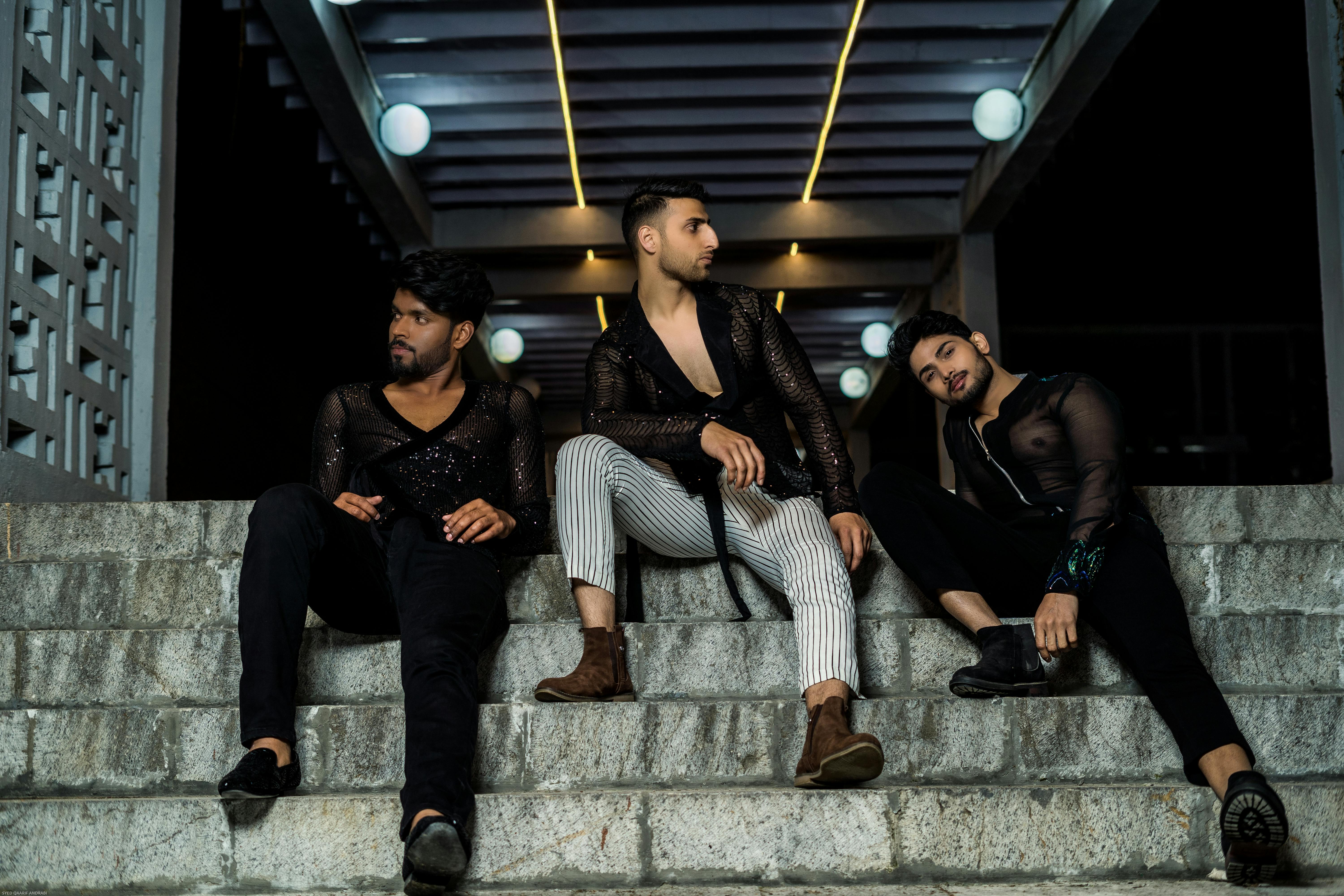 Models in Glistening Black Shirts · Free Stock Photo