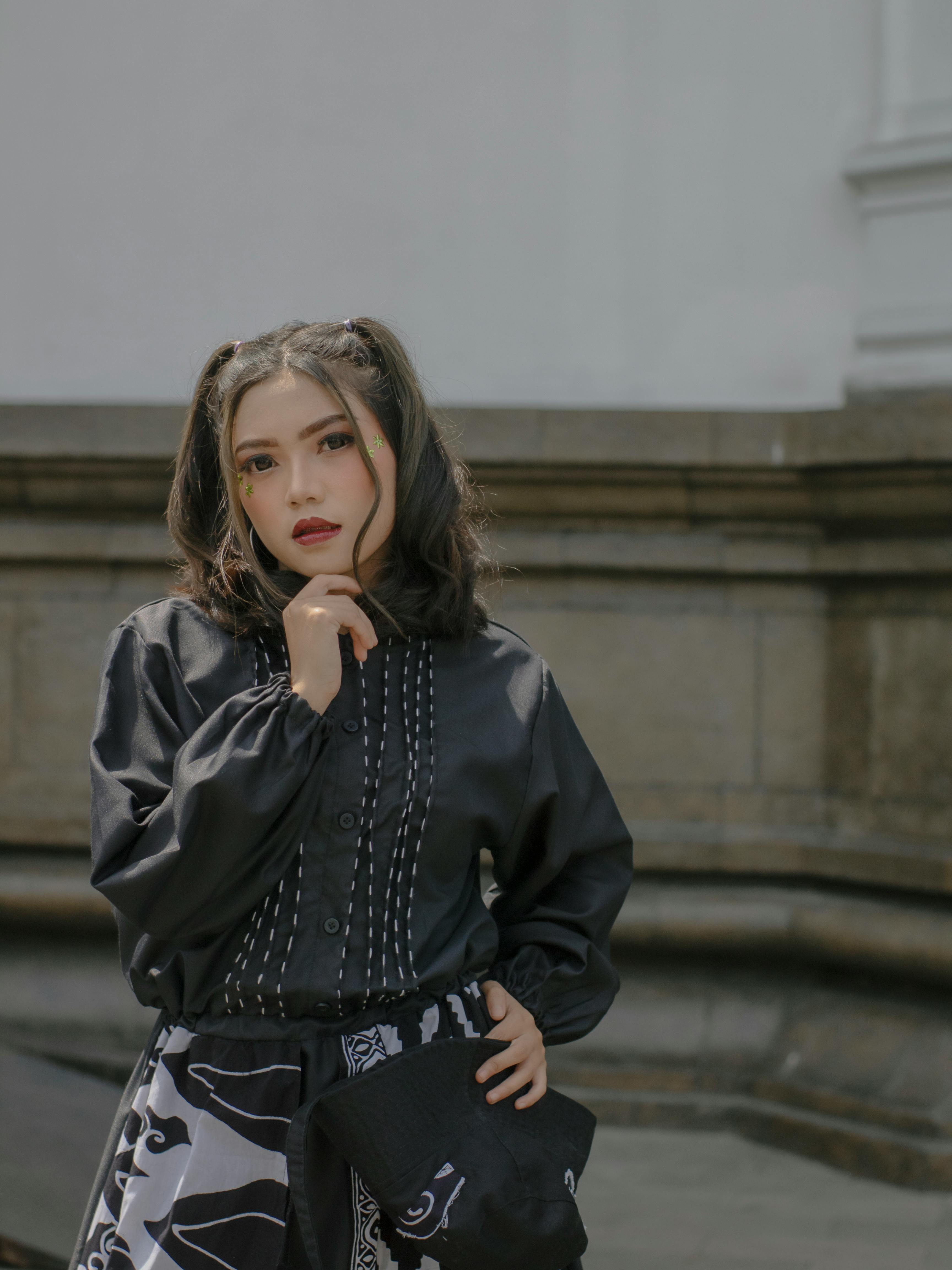 Woman in White Clothes Posing in Tunnel with Glass Walls · Free Stock Photo
