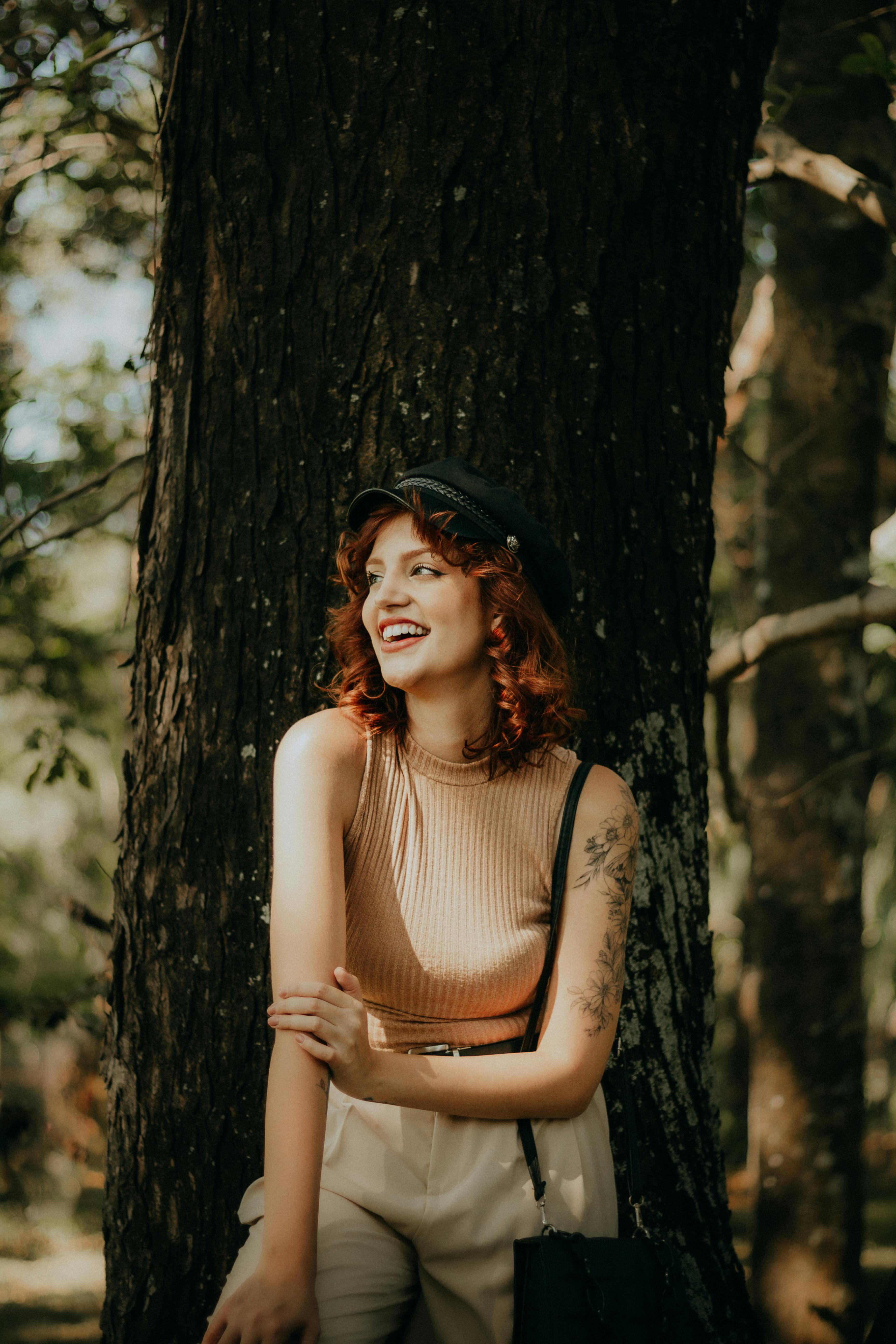 Smiling Woman under Tree · Free Stock Photo