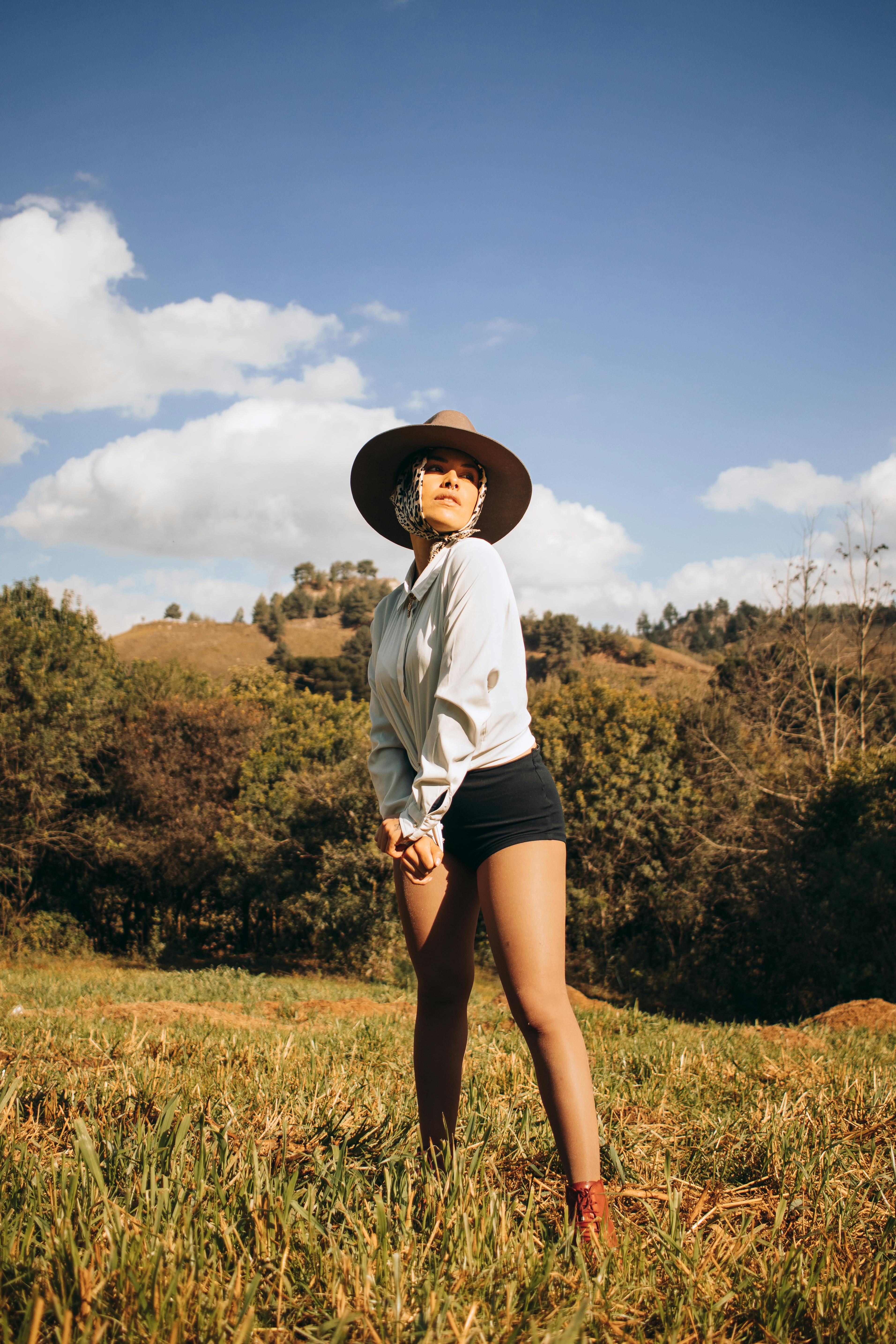 Woman Posing in Hat and Shirt · Free Stock Photo