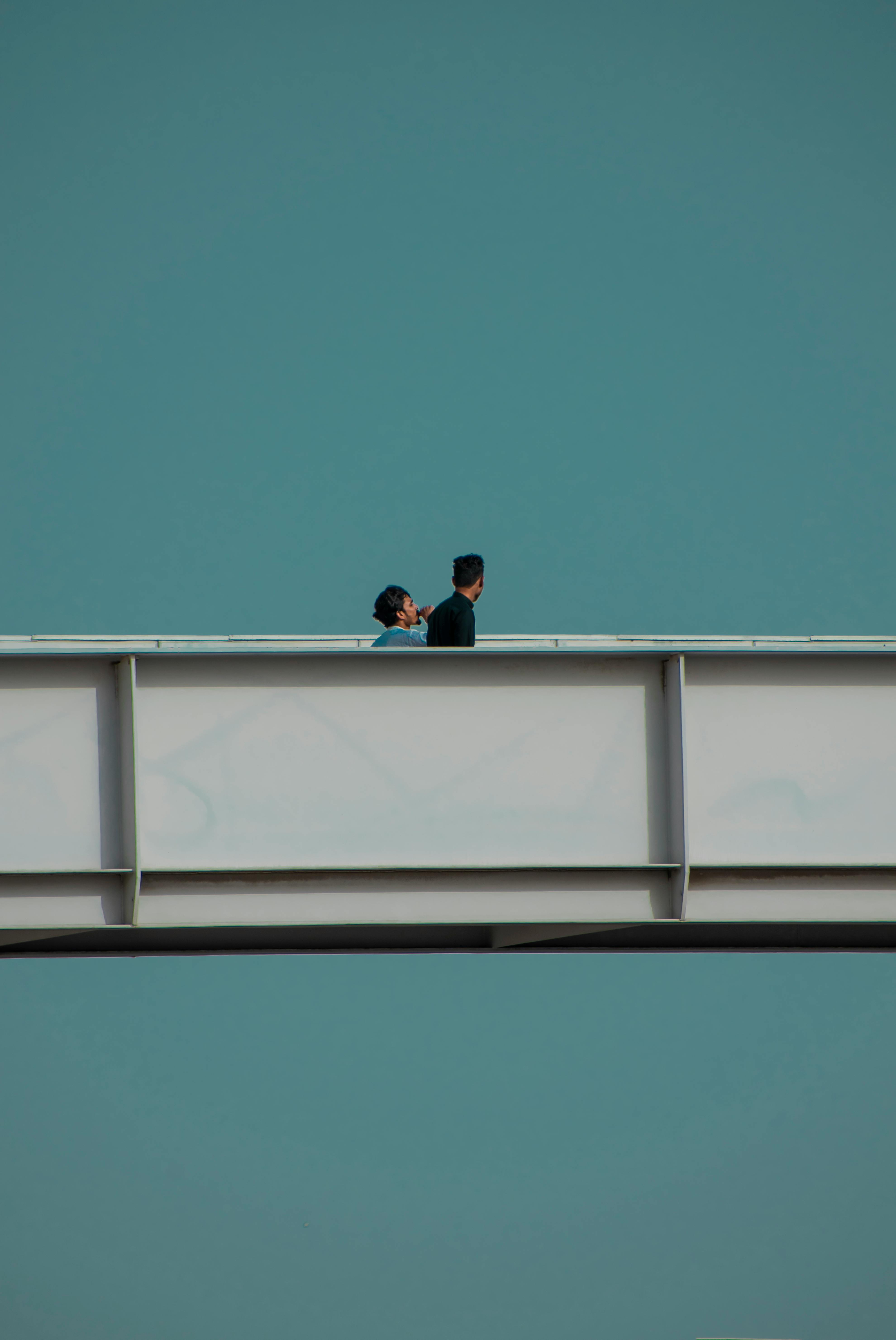 Best Friends Standing on Bridge · Free Stock Photo