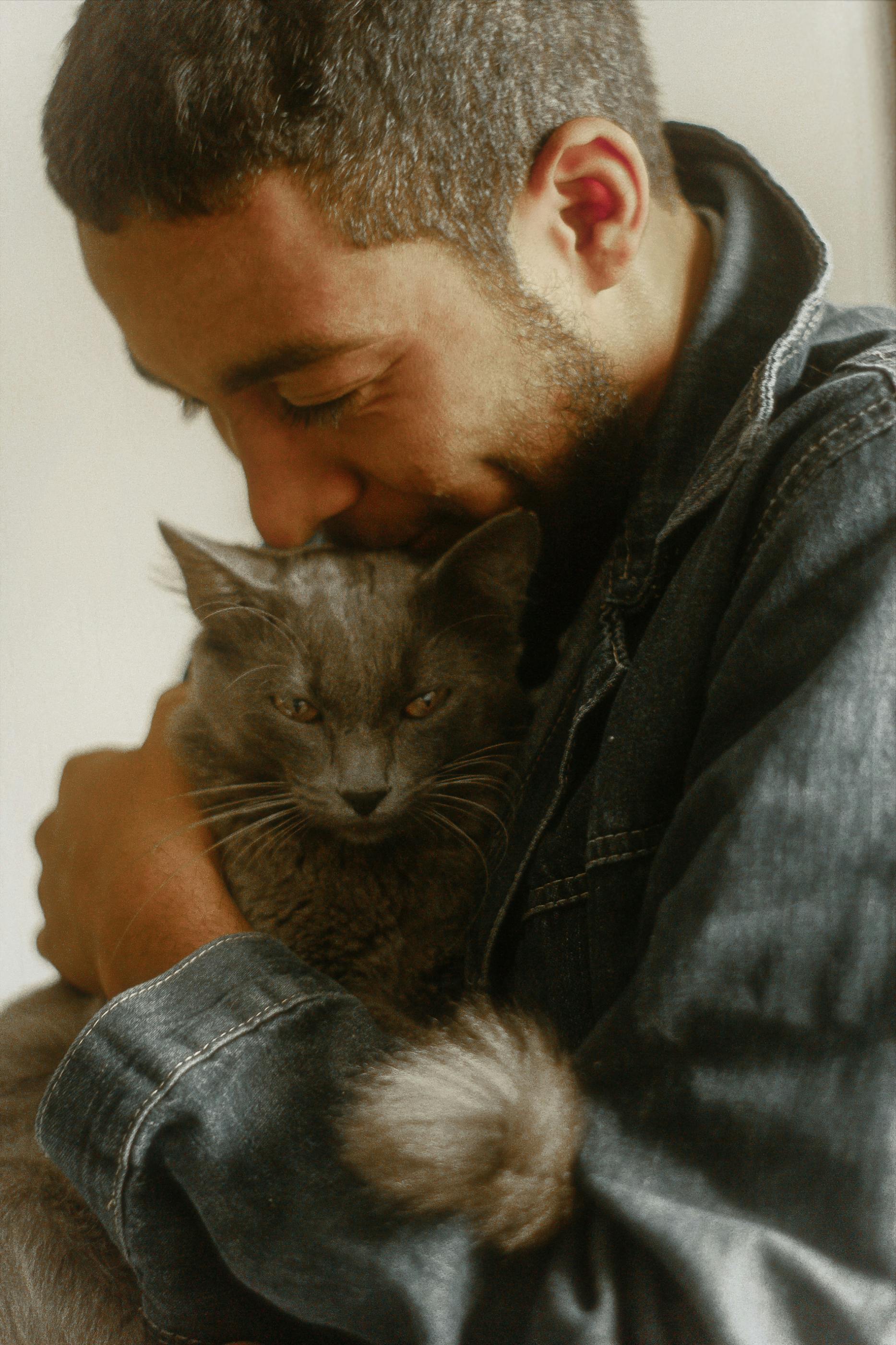 Man Hugging Cat · Free Stock Photo