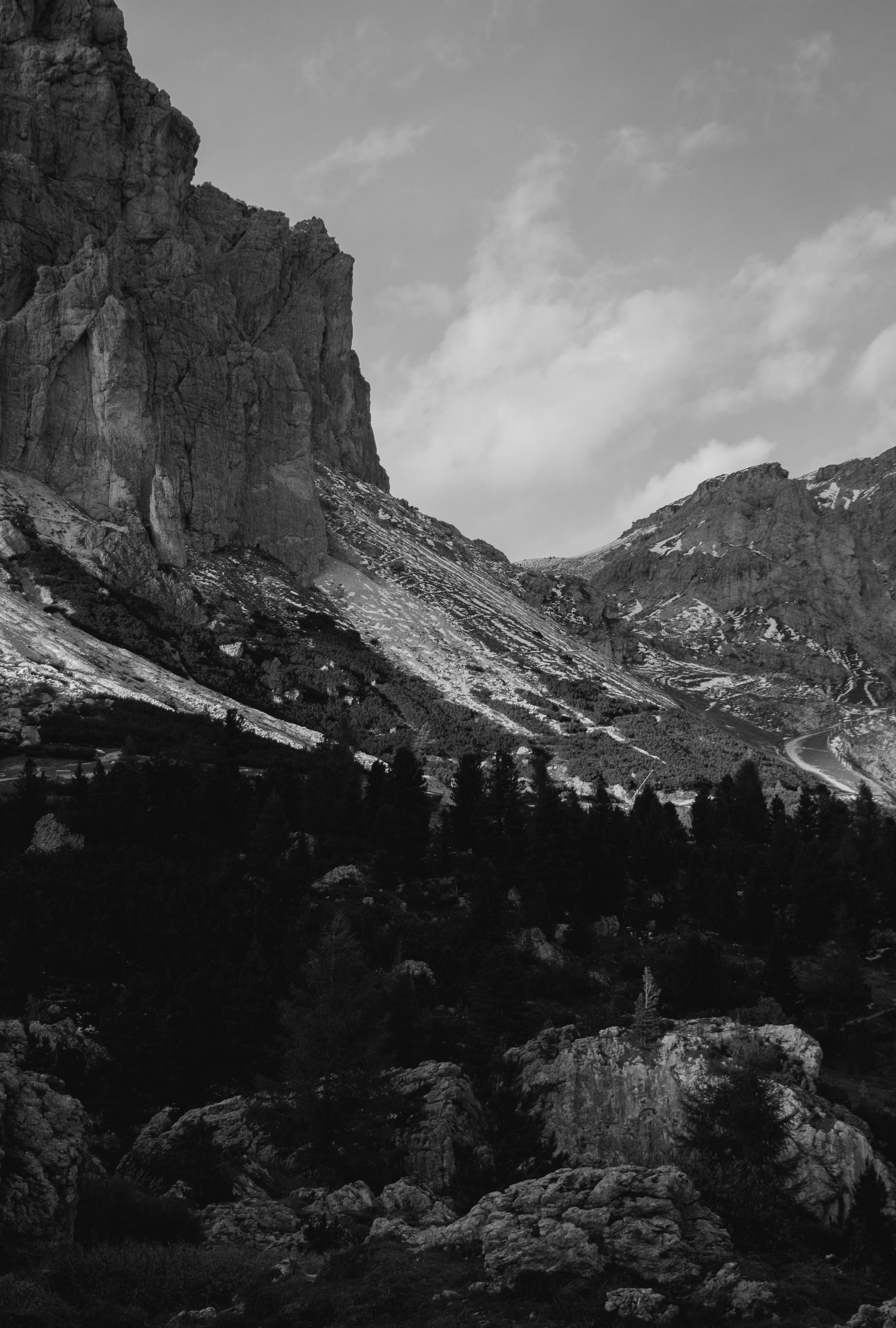 Black and white photograph of mountains in the distance · Free Stock Photo