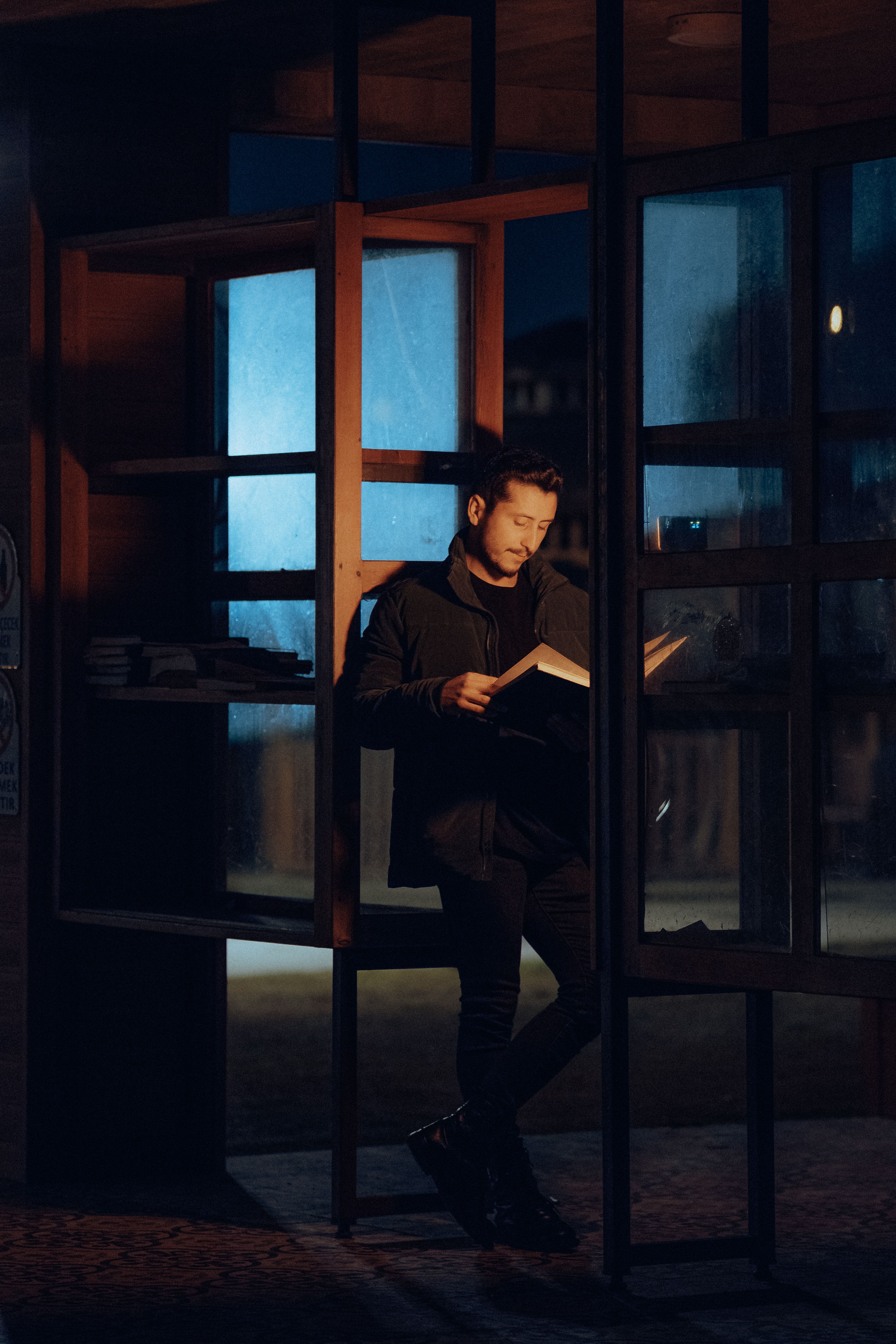 Man Standing and Reading Book · Free Stock Photo