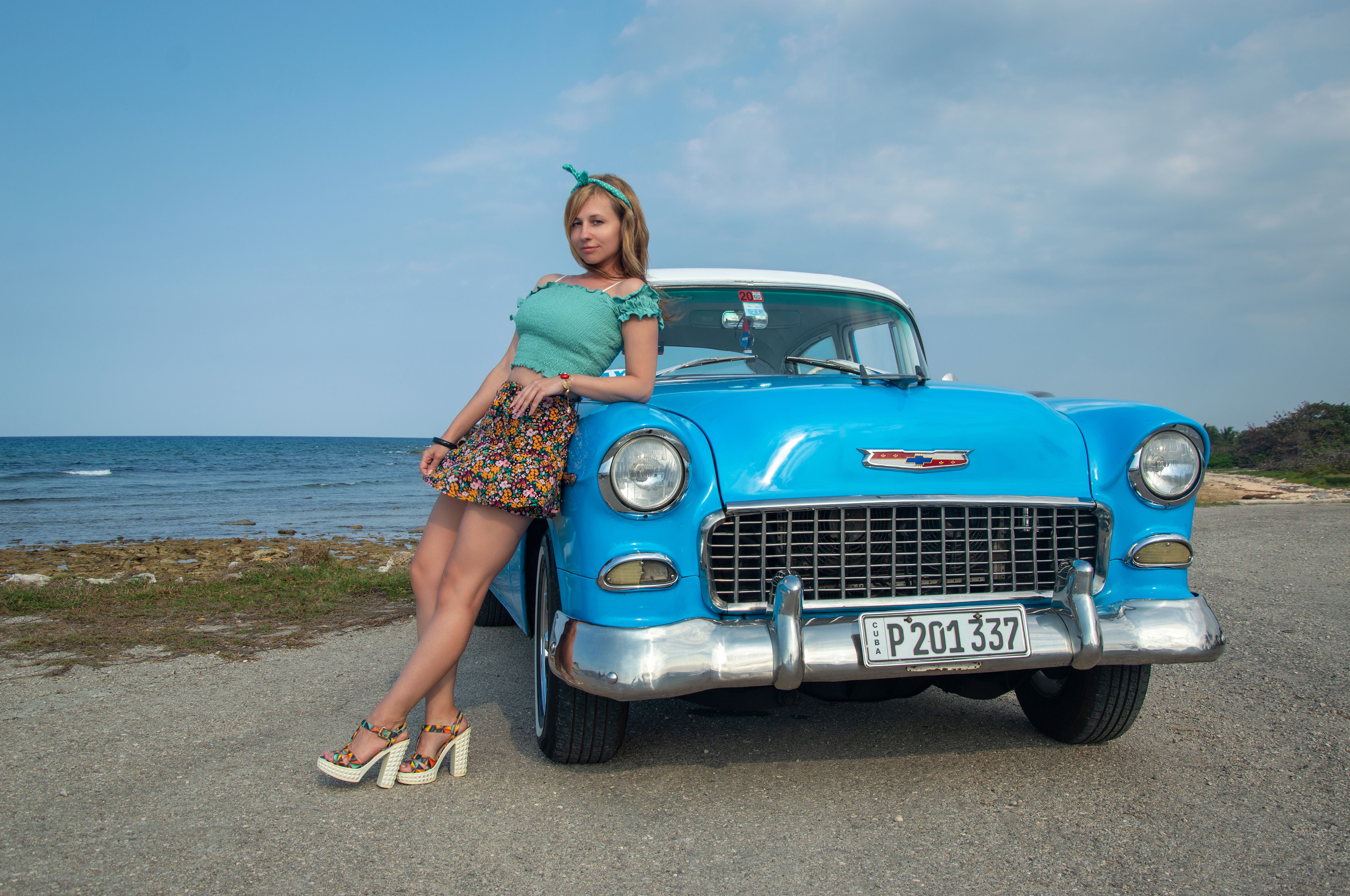Woman Standing next to a Blue Vintage Chevrolet · Free Stock Photo