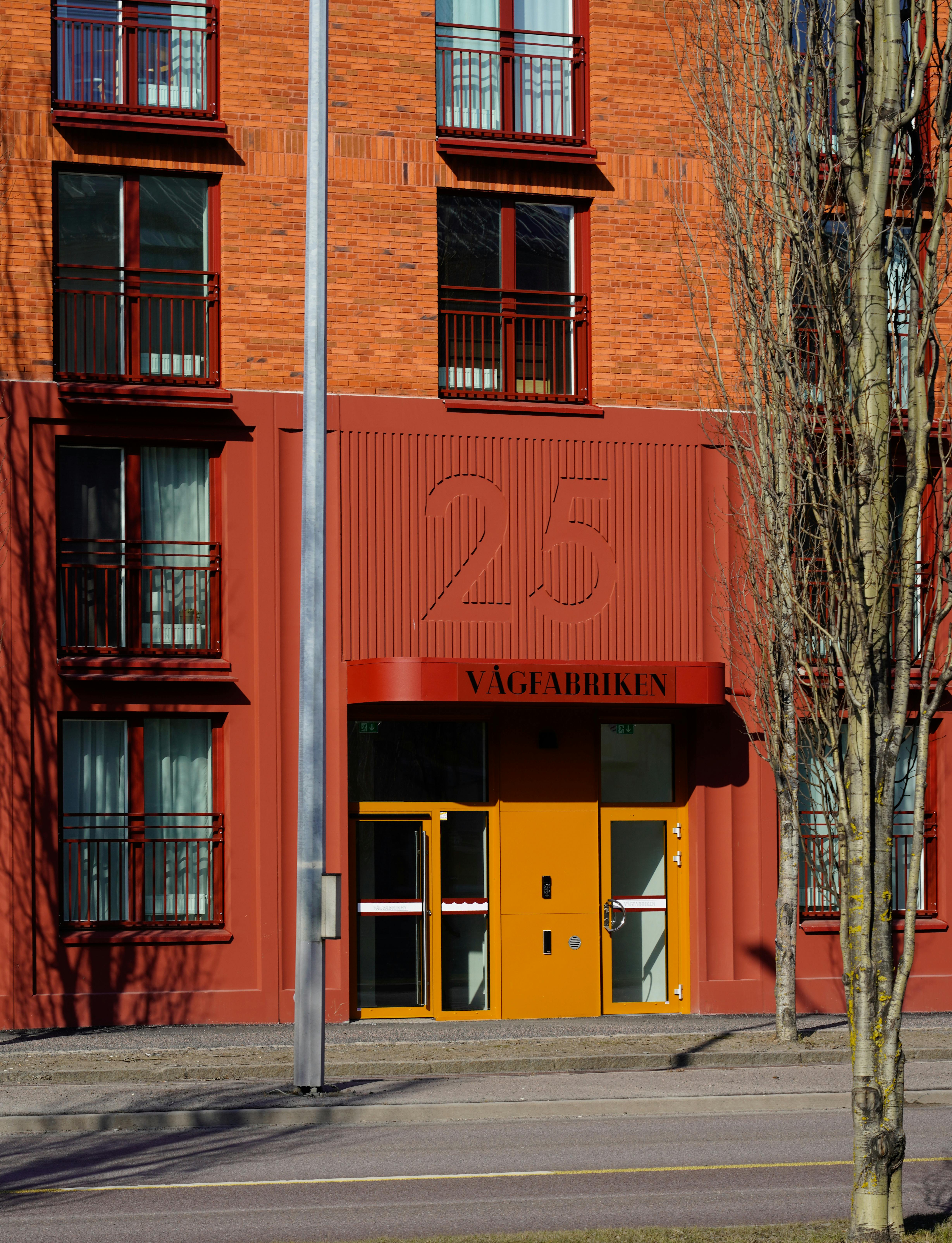 Exterior of a Red Brick Residential Building in City · Free Stock Photo