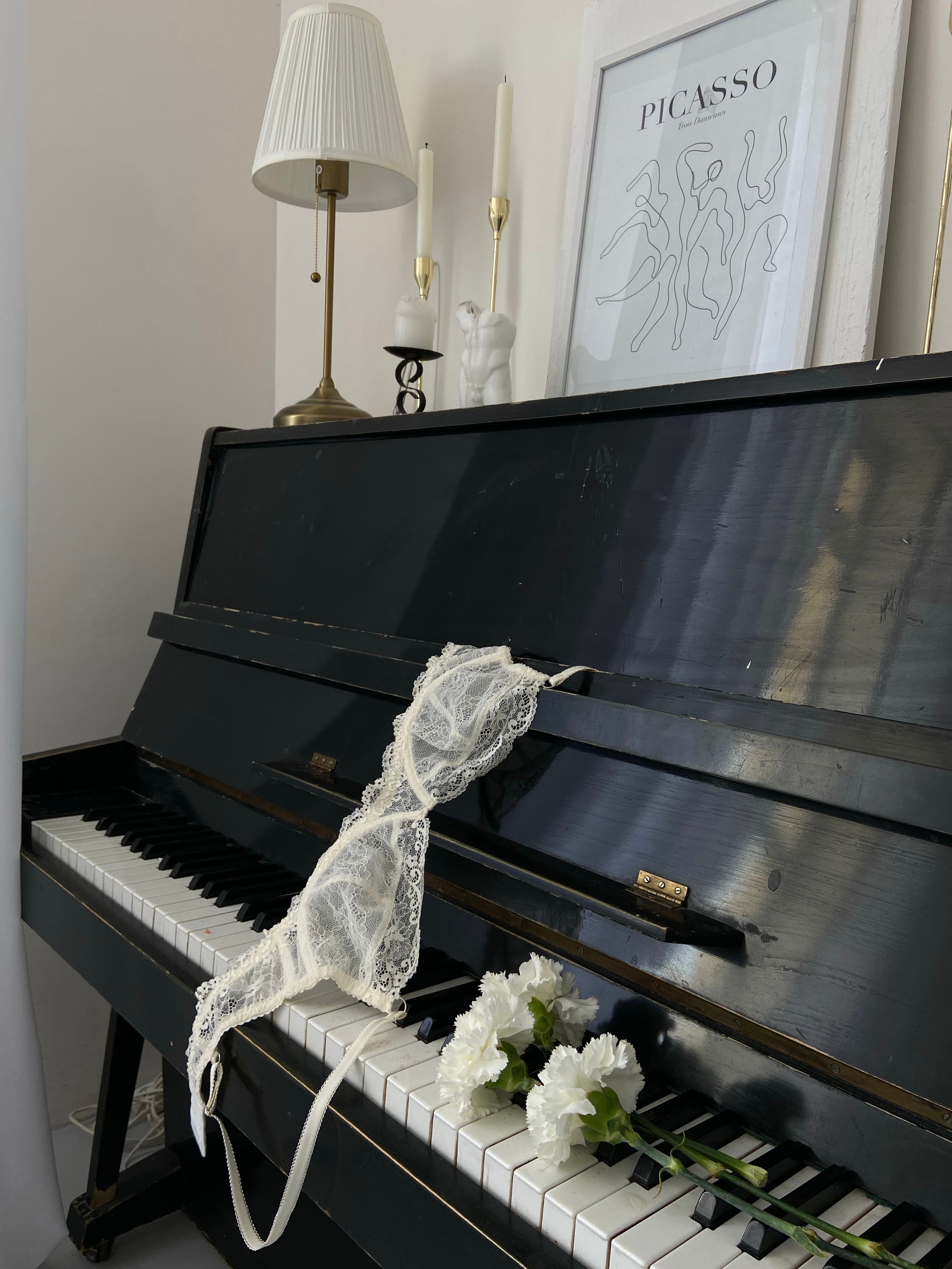 A Lace Bra and White Flowers on a Piano · Free Stock Photo