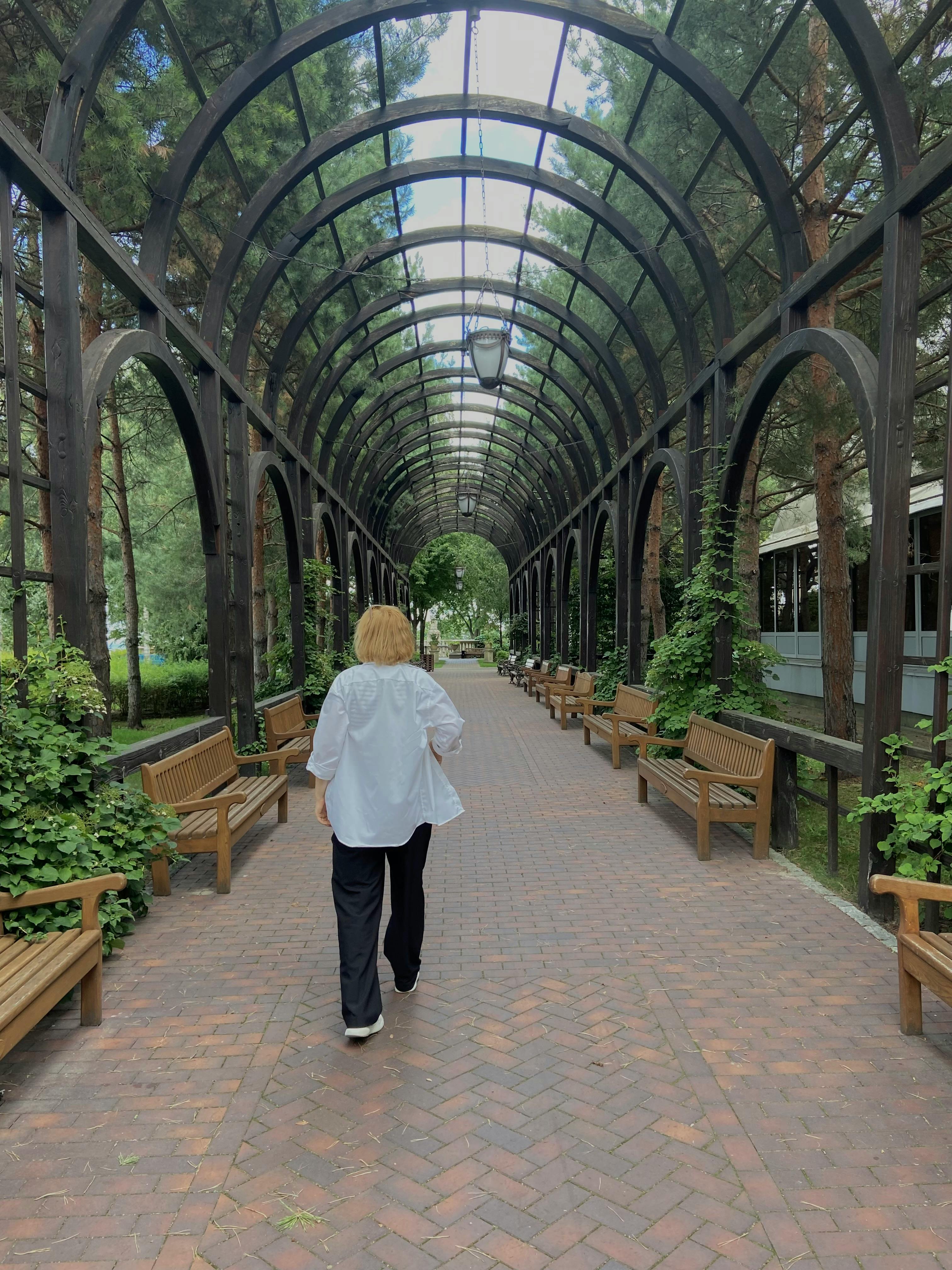 Arched Walkway with Benches · Free Stock Photo