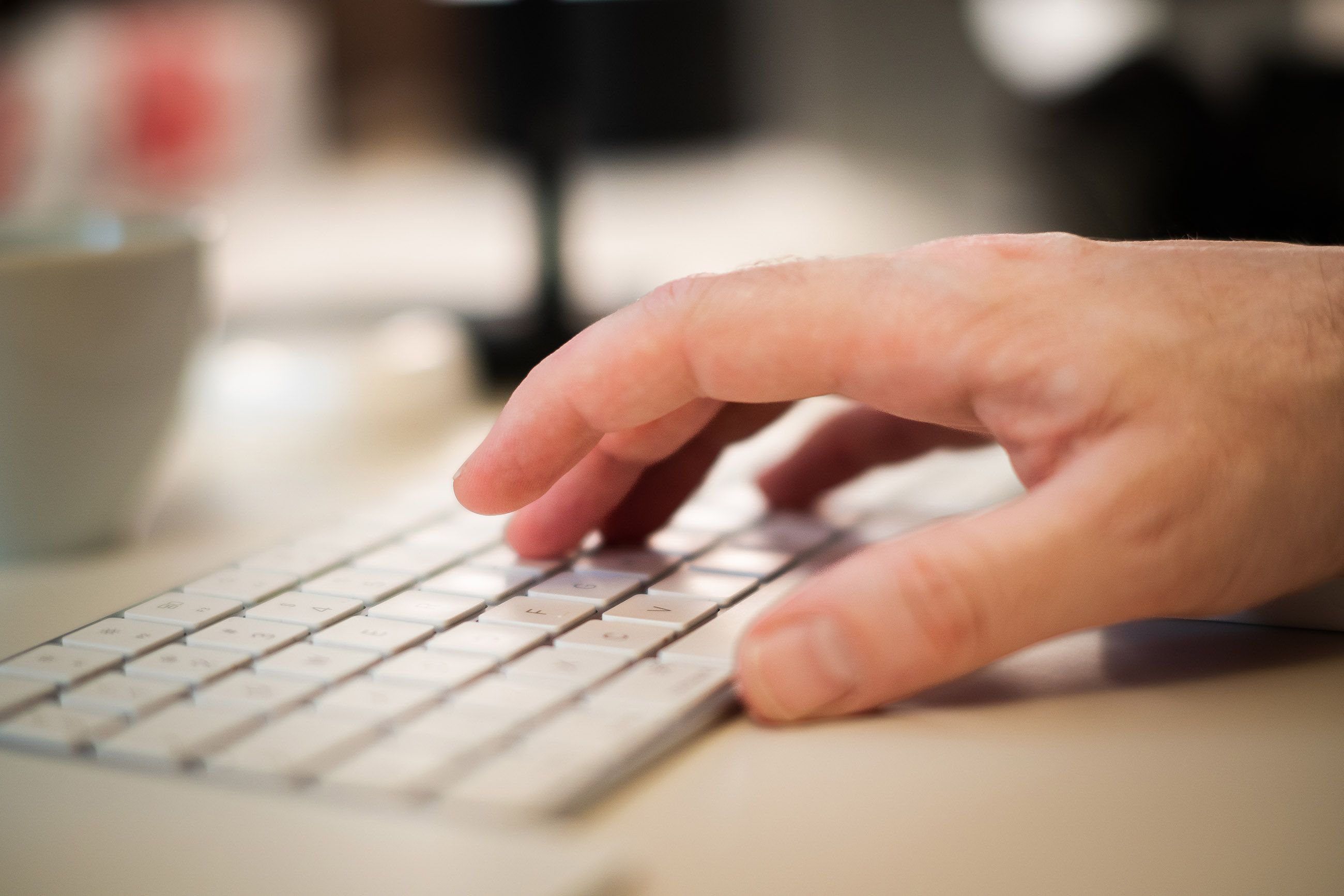 White Caution Cone on Keyboard · Free Stock Photo