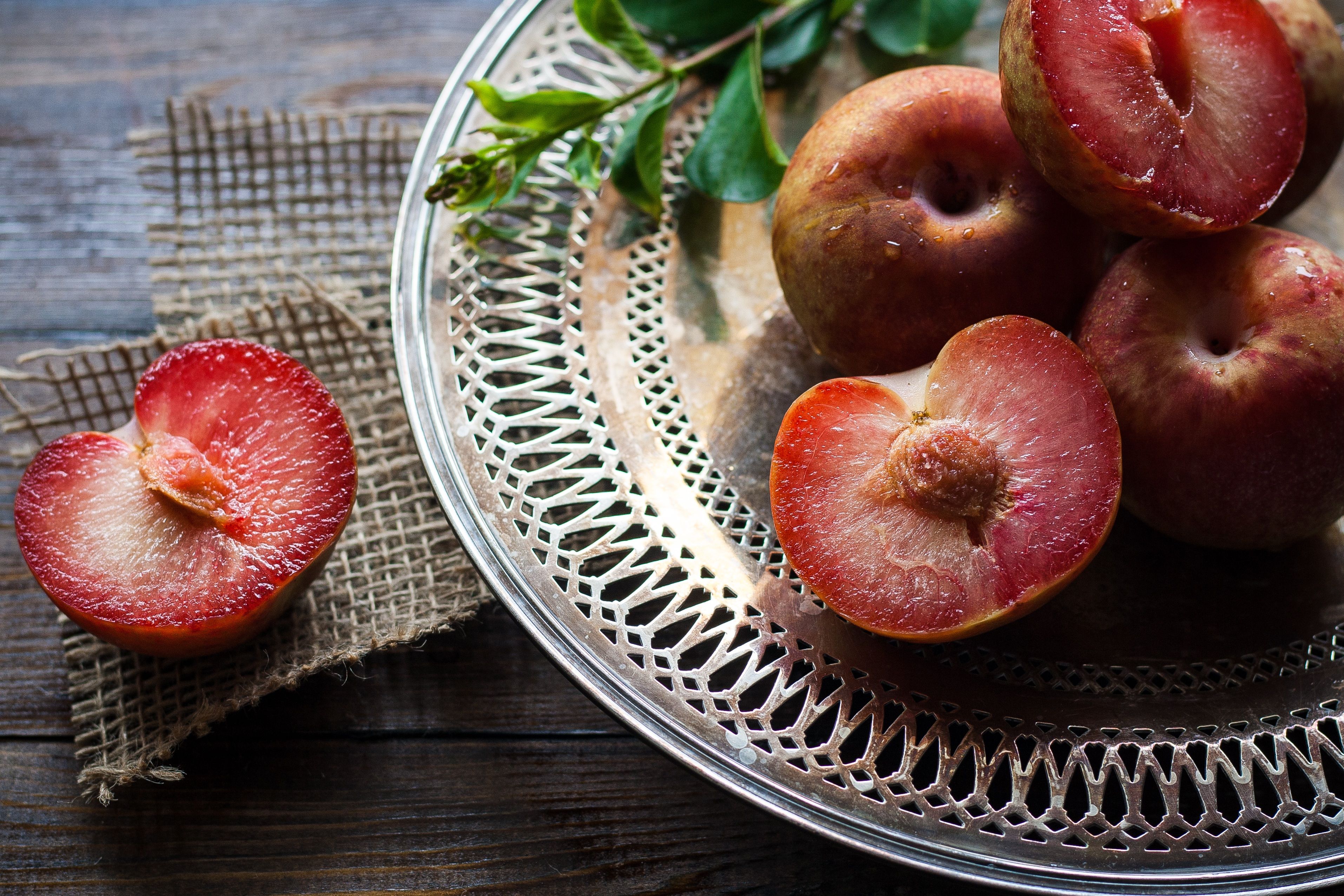 Sliced Plums on Silver Round Platter · Free Stock Photo