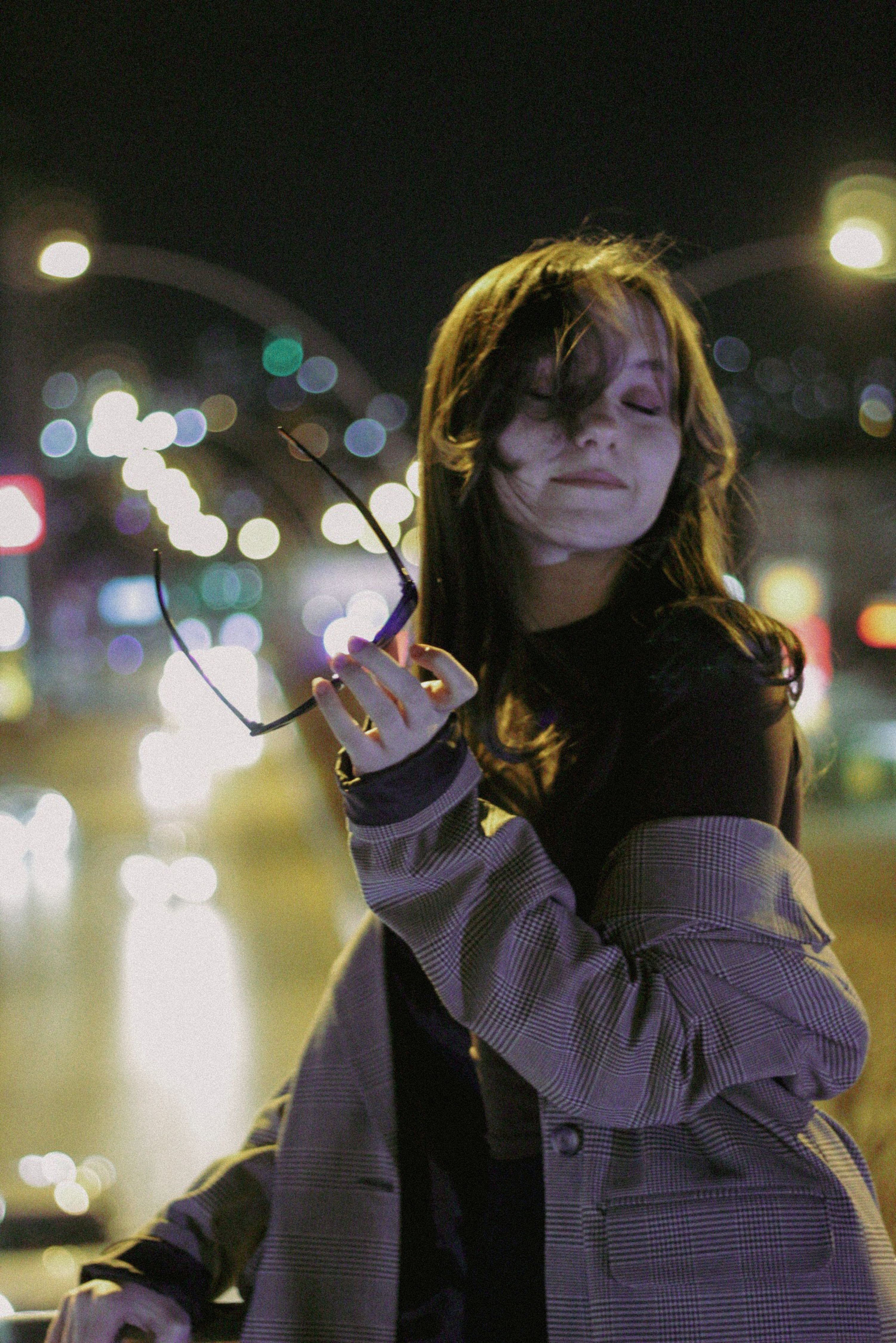 Woman Posing with Eyes Closed at Night · Free Stock Photo