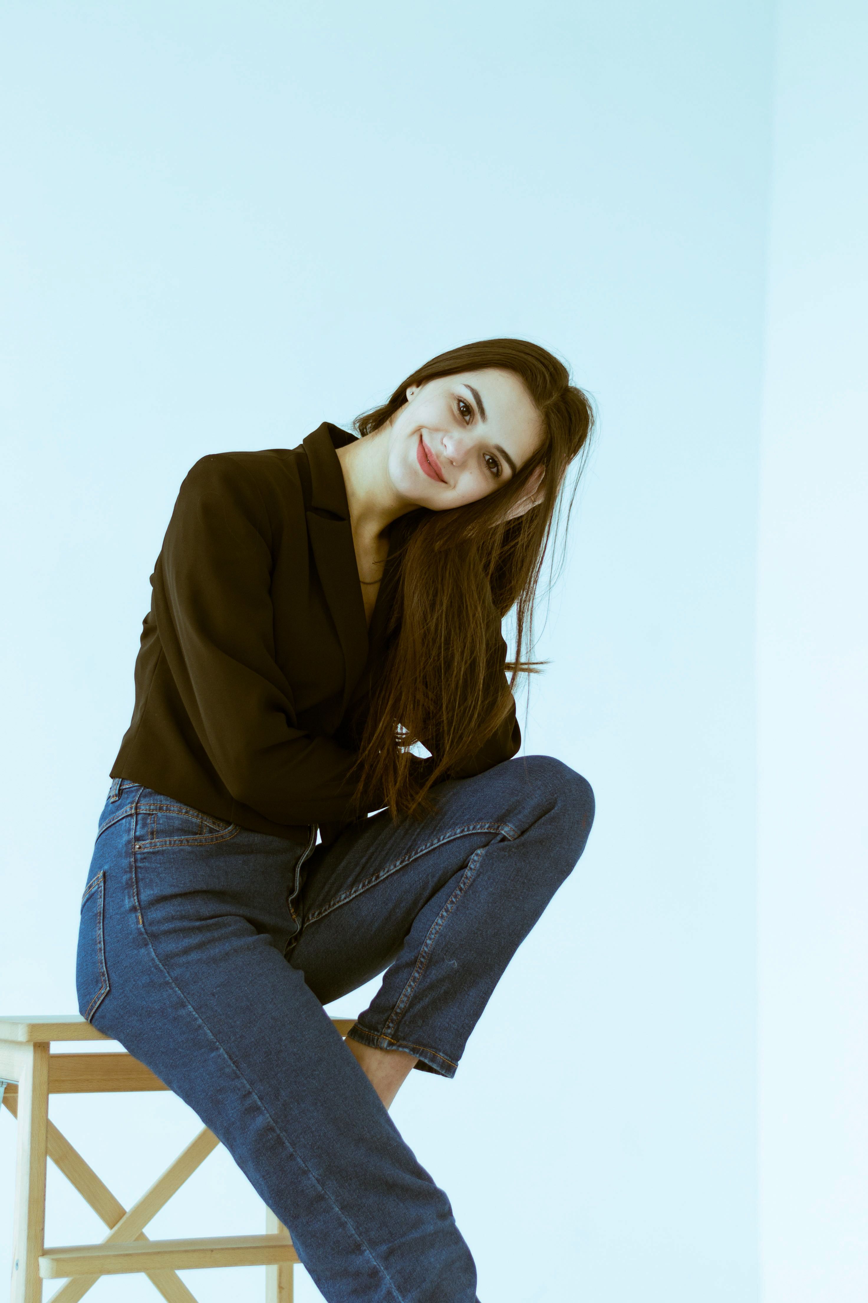 Smiling Woman Posing on Blue Background · Free Stock Photo