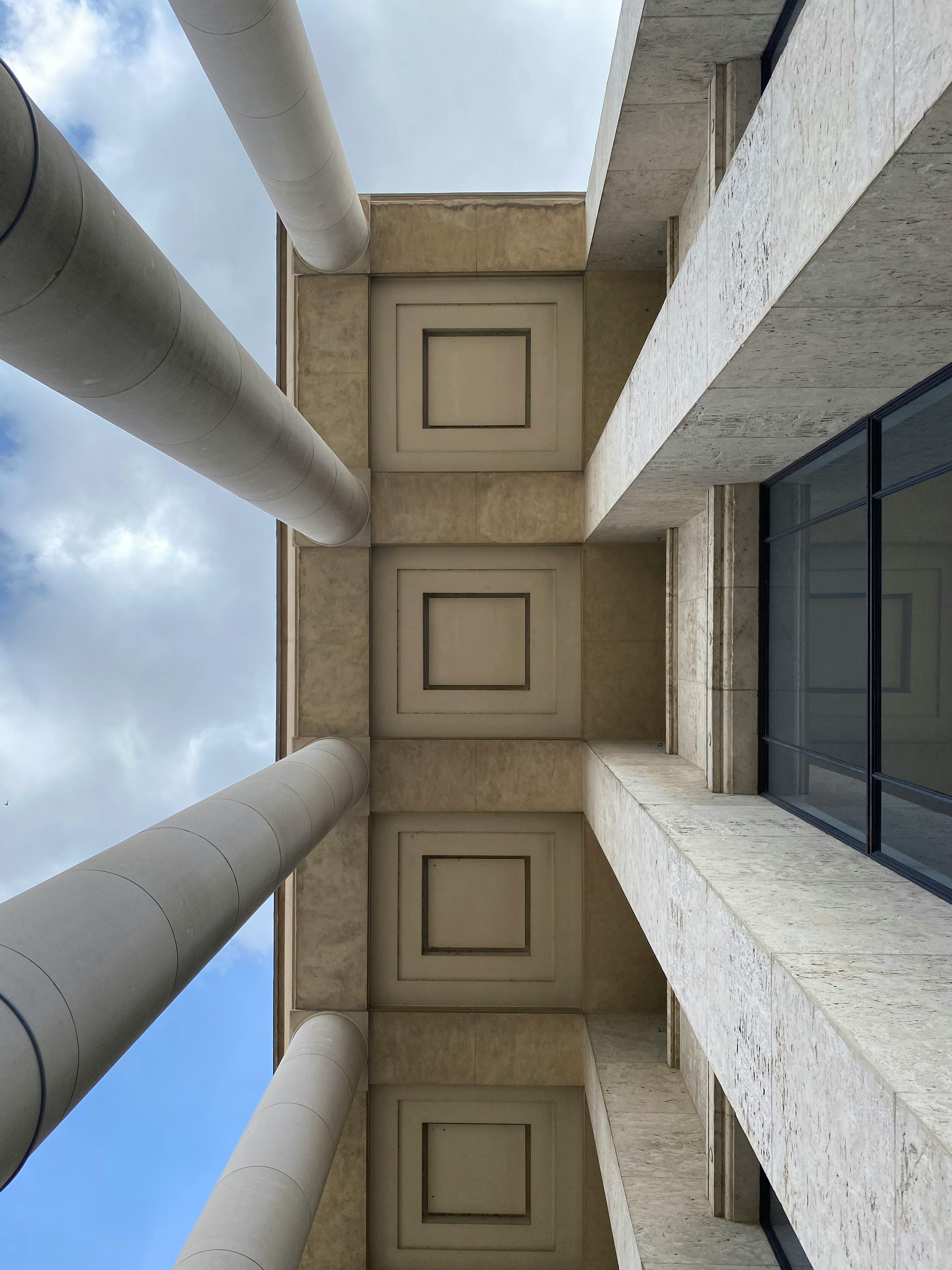Stone Columns in Building against Blue Sky · Free Stock Photo