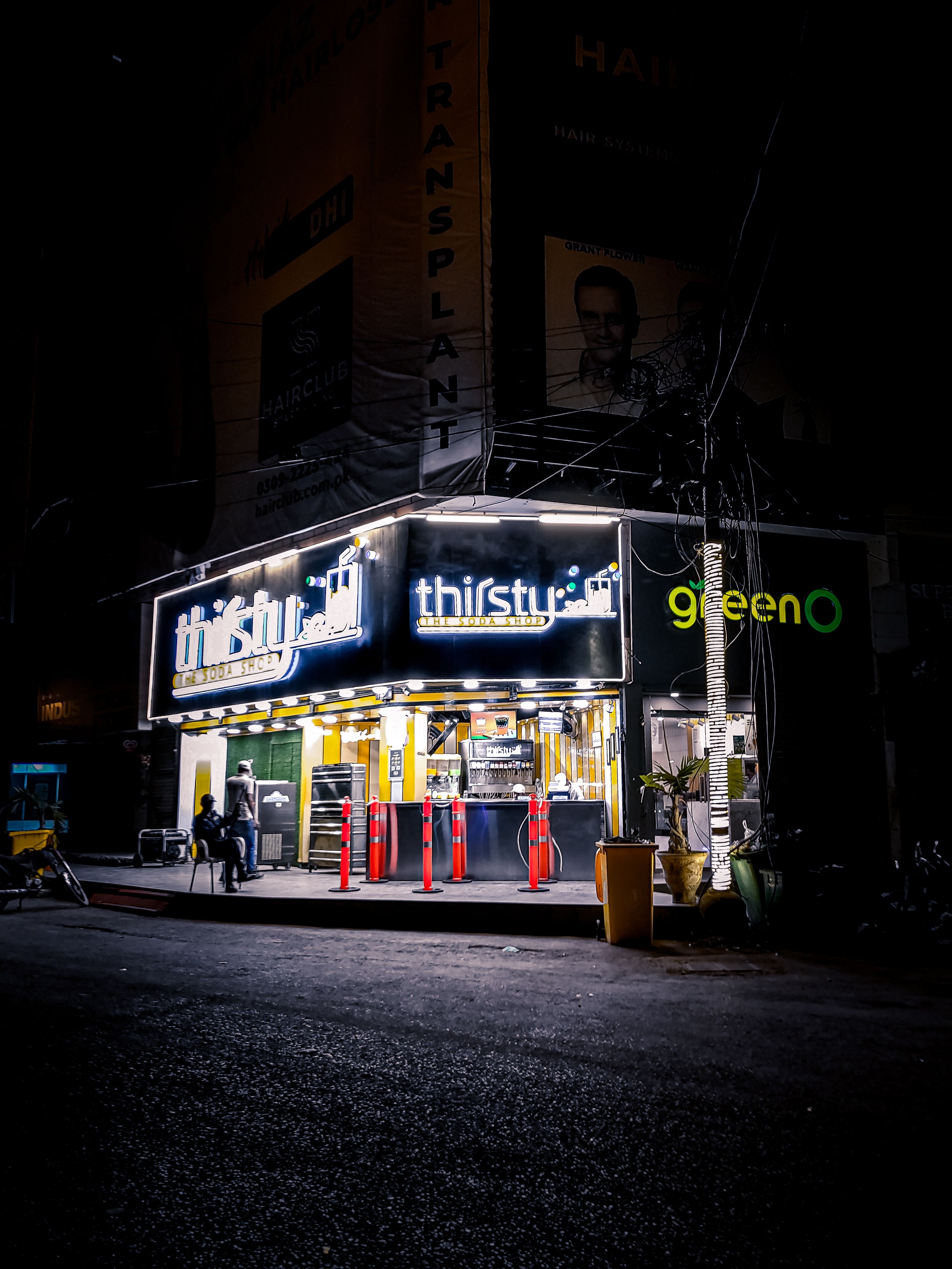 Exterior of an Illuminated Soda Store at Night · Free Stock Photo