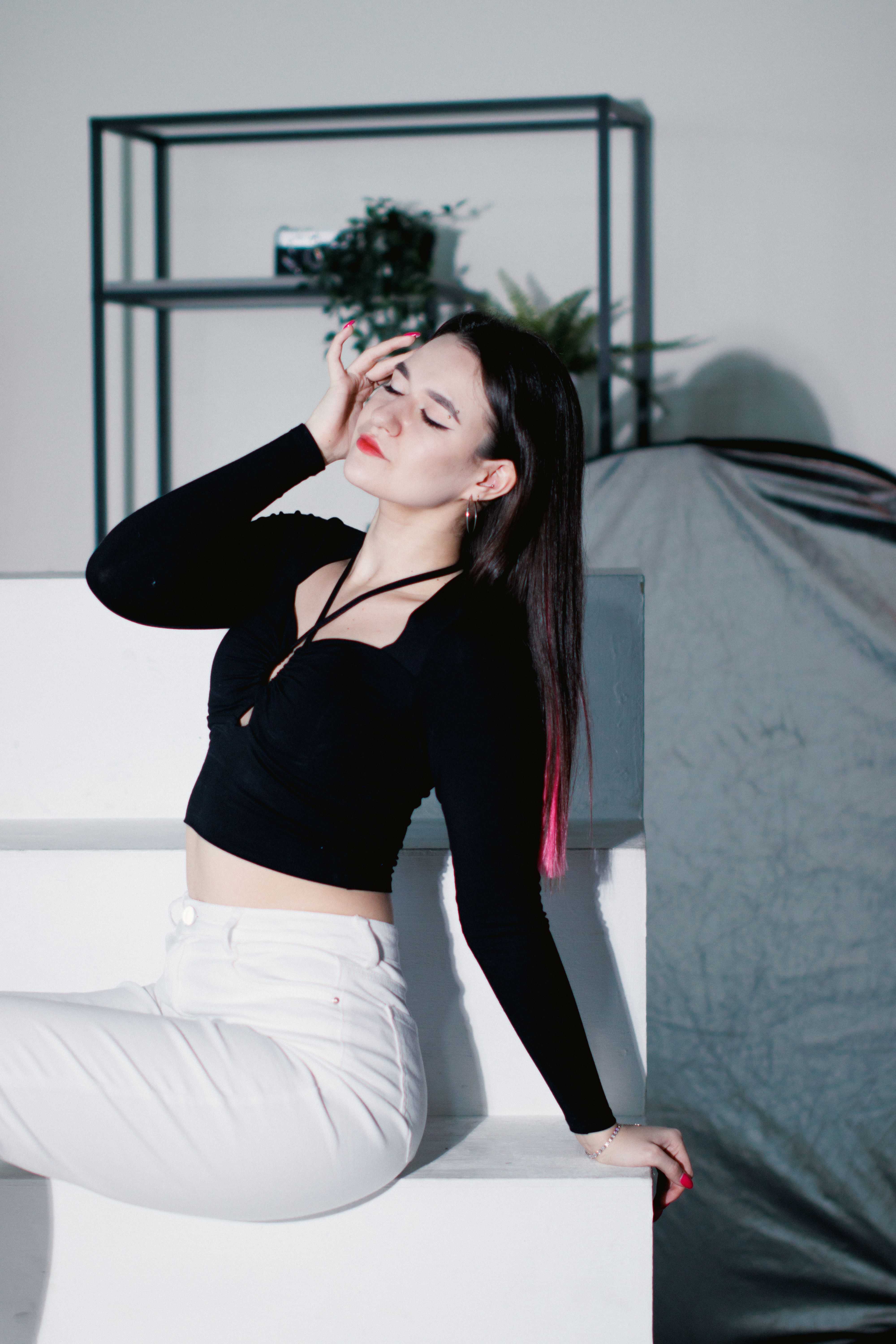 Woman in White Blouse and Black Palazzo Pants Lying on a Sofa · Free ...