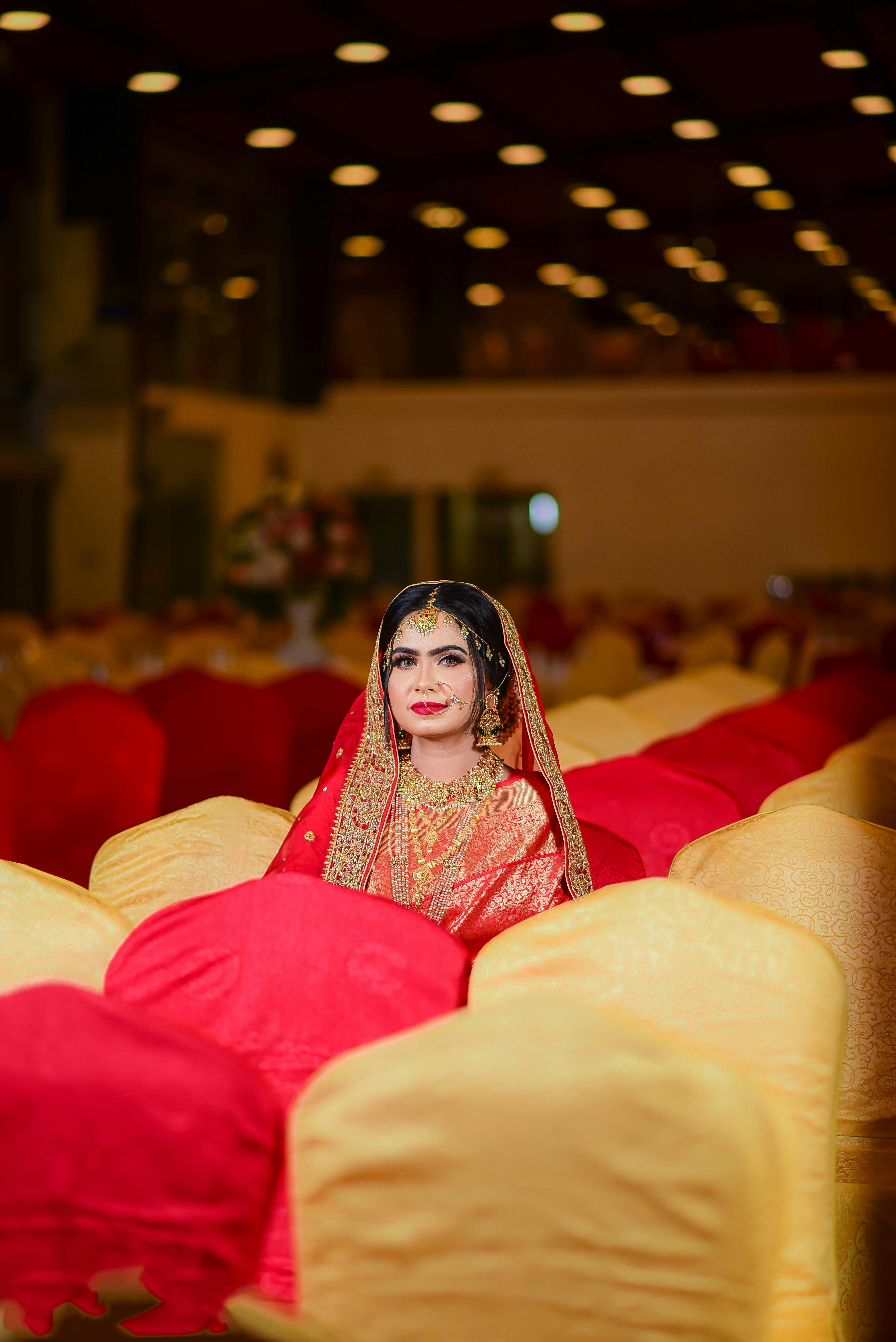 Indian Bride Sitting Alone in a Wedding Hall · Free Stock Photo