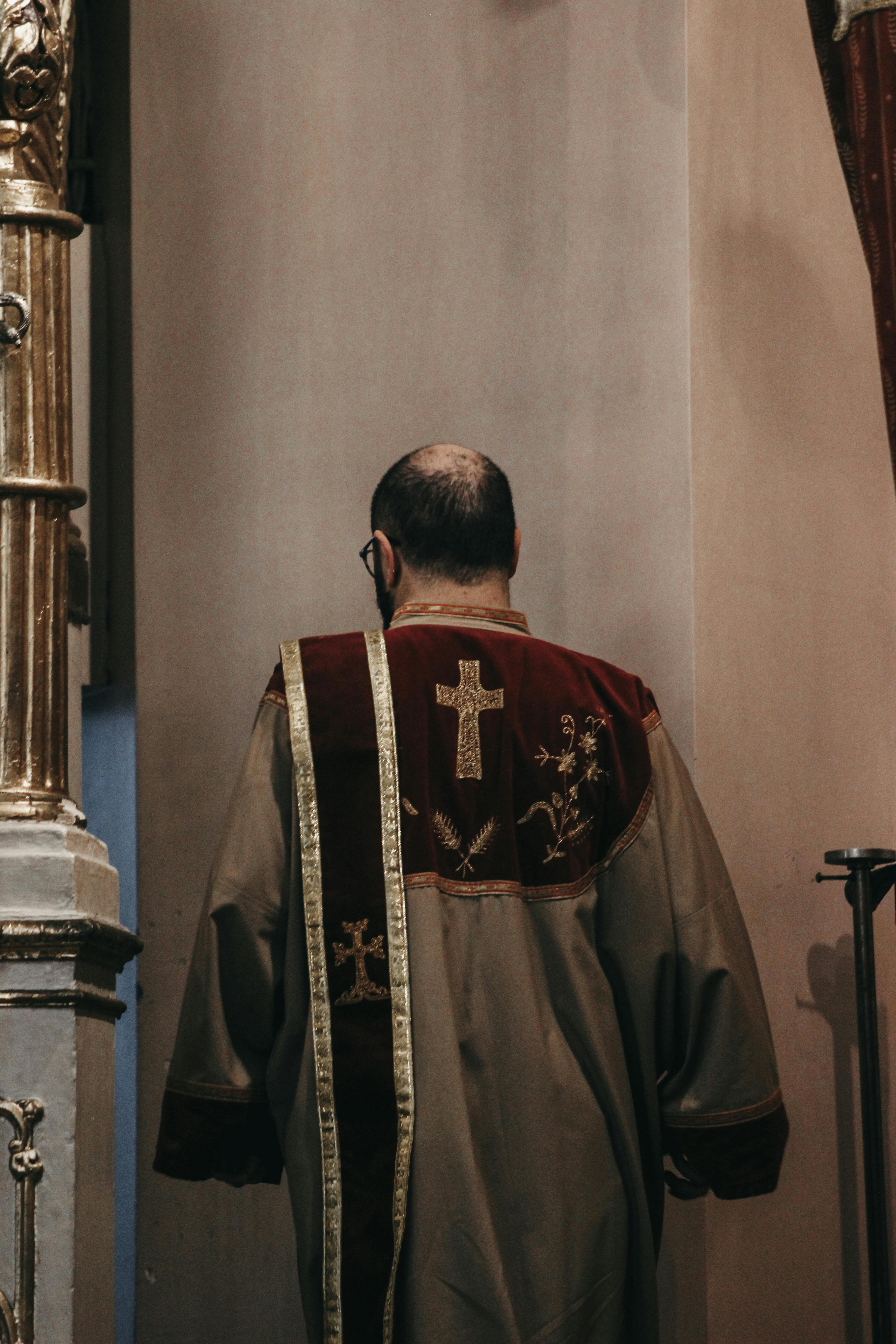 Priest in Vestment Standing in Church · Free Stock Photo