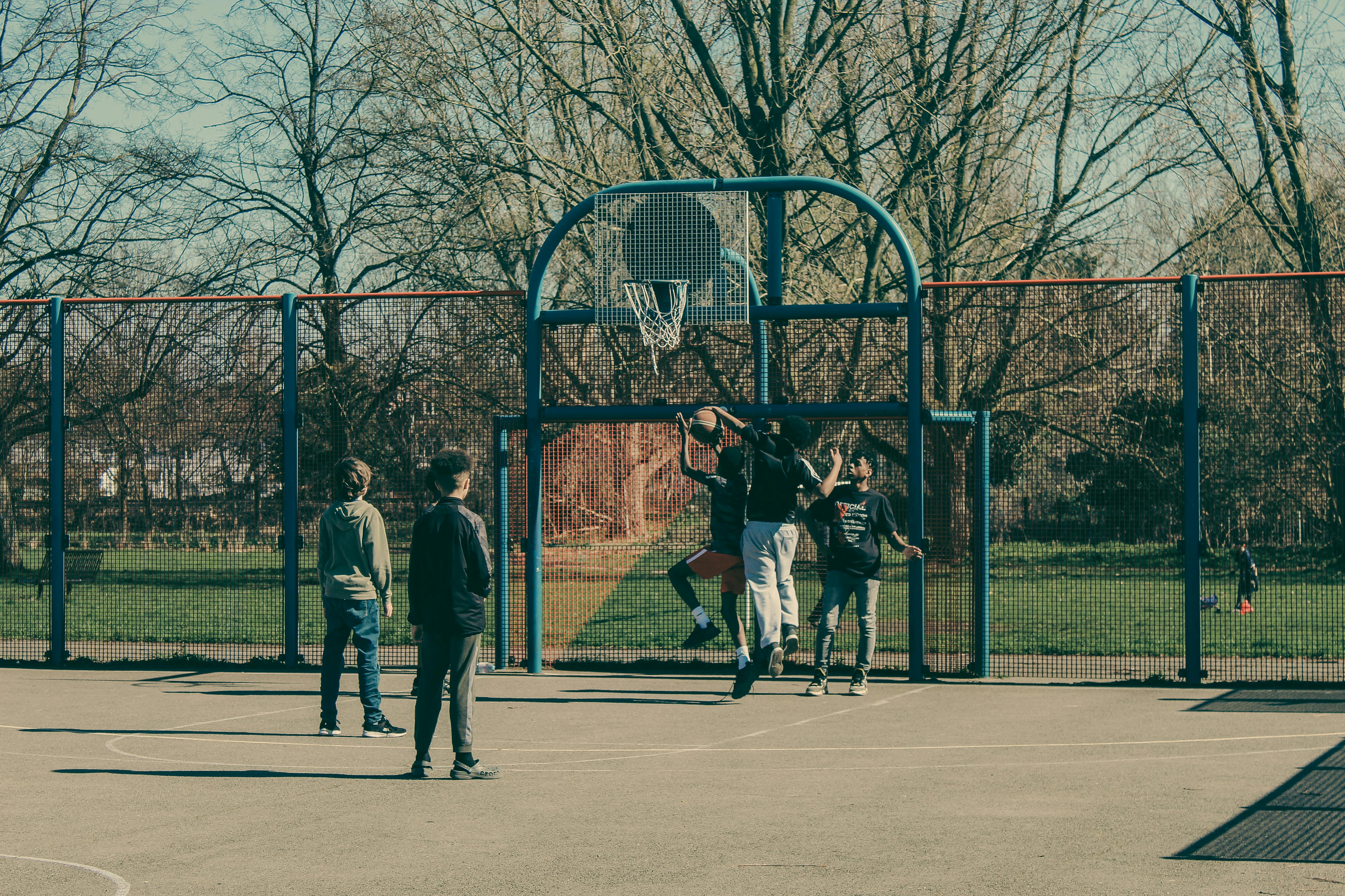 Boys Playing Basketball Outdoors · Free Stock Photo