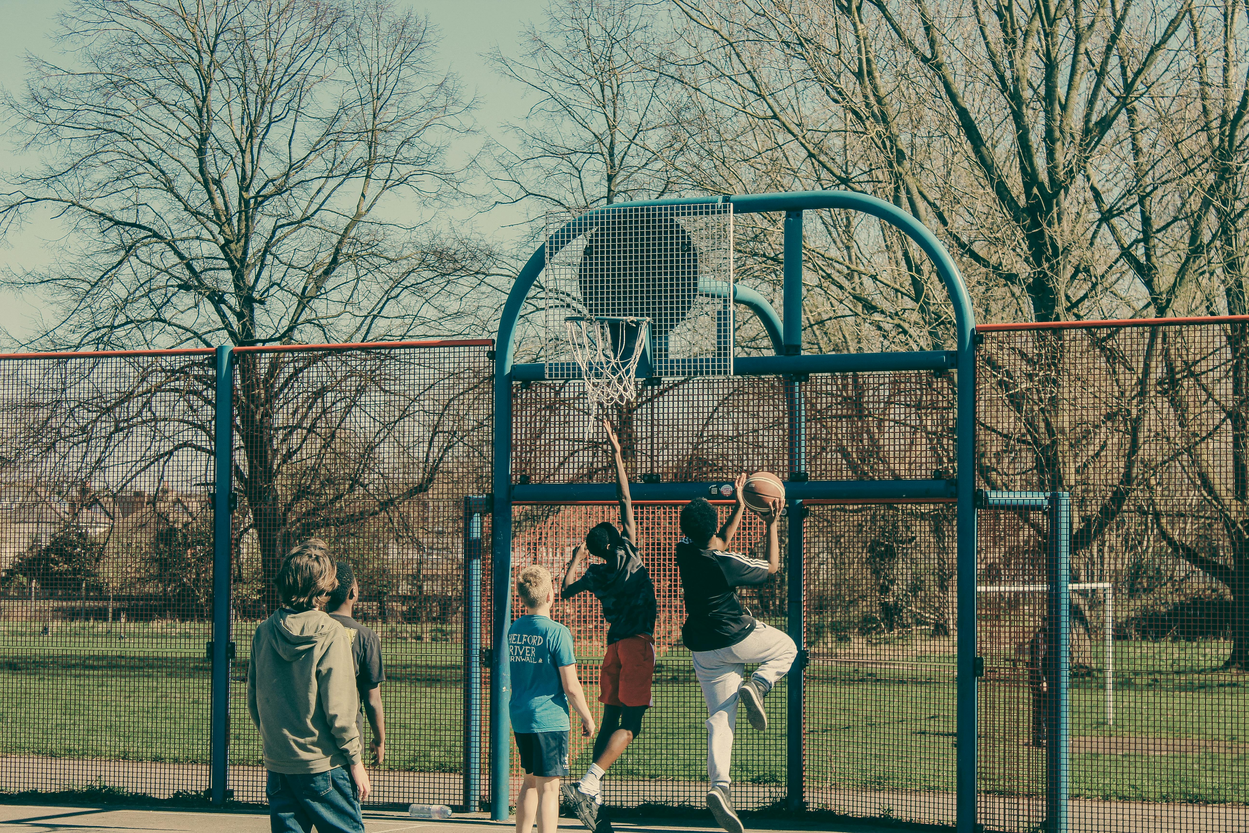 Boys Playing Basketball Outdoors · Free Stock Photo