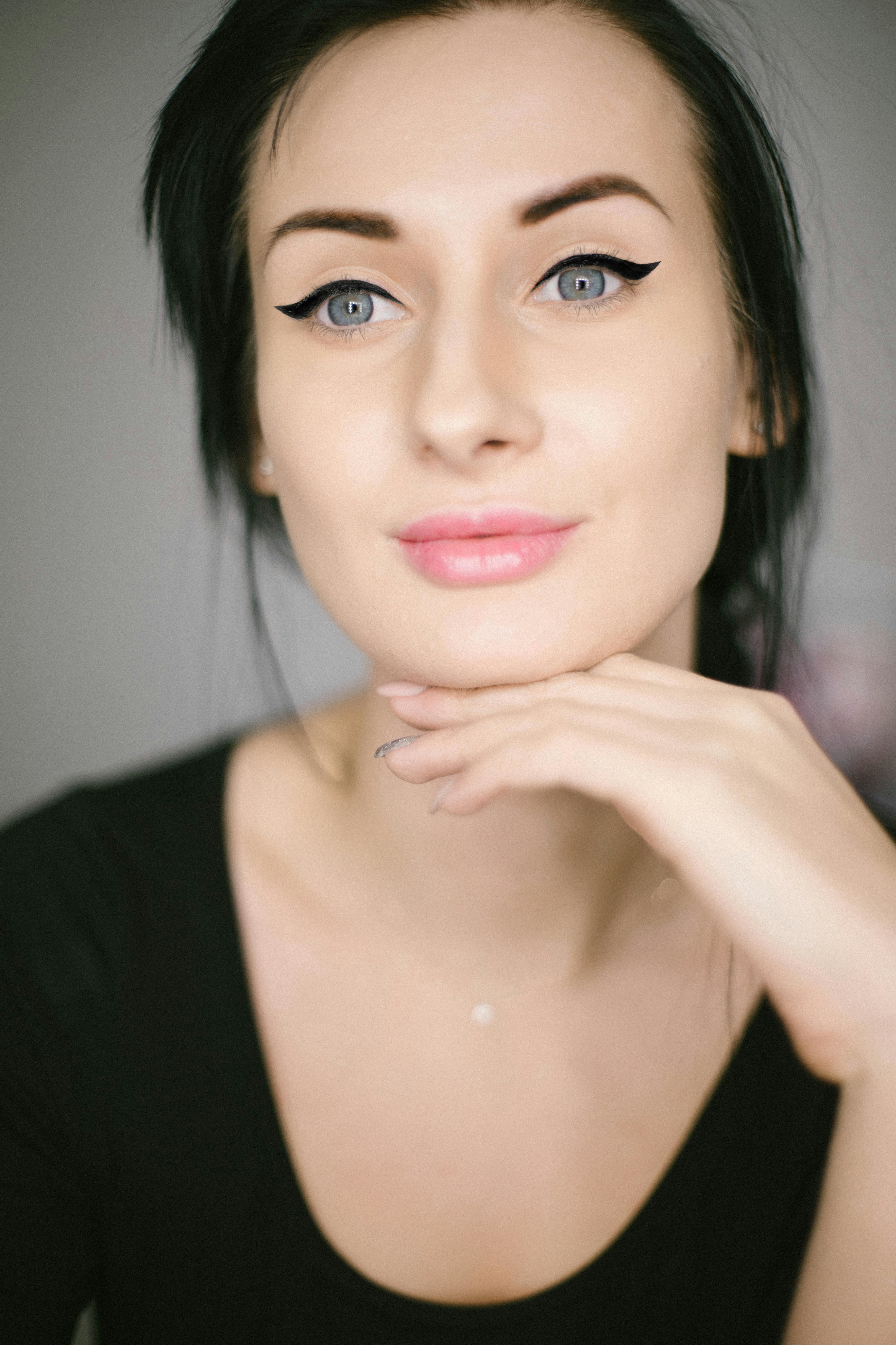Woman Holding Her Chin · Free Stock Photo